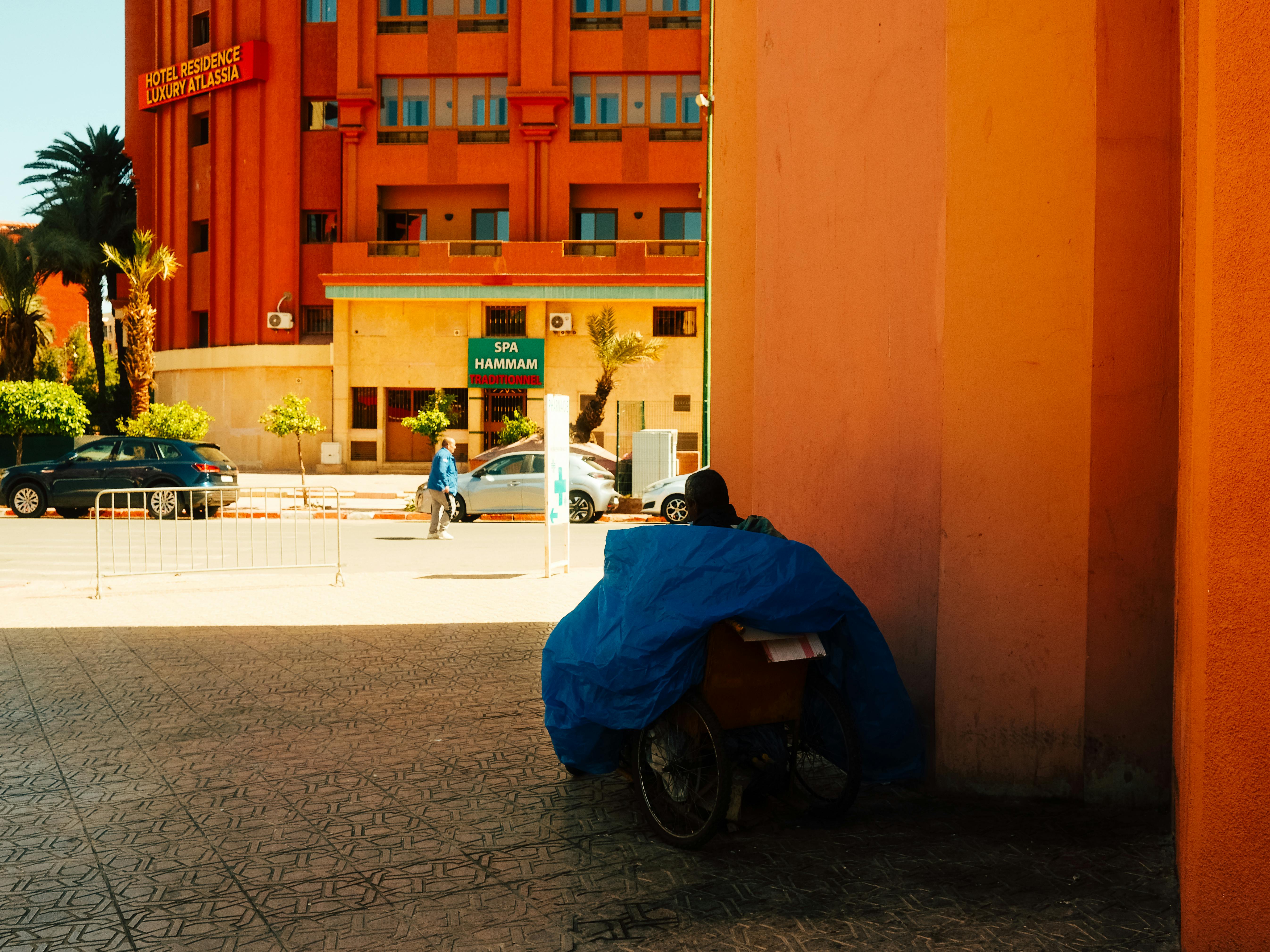 Urban Street Scene with Hotel and Cycle Rickshaw · Free Stock Photo