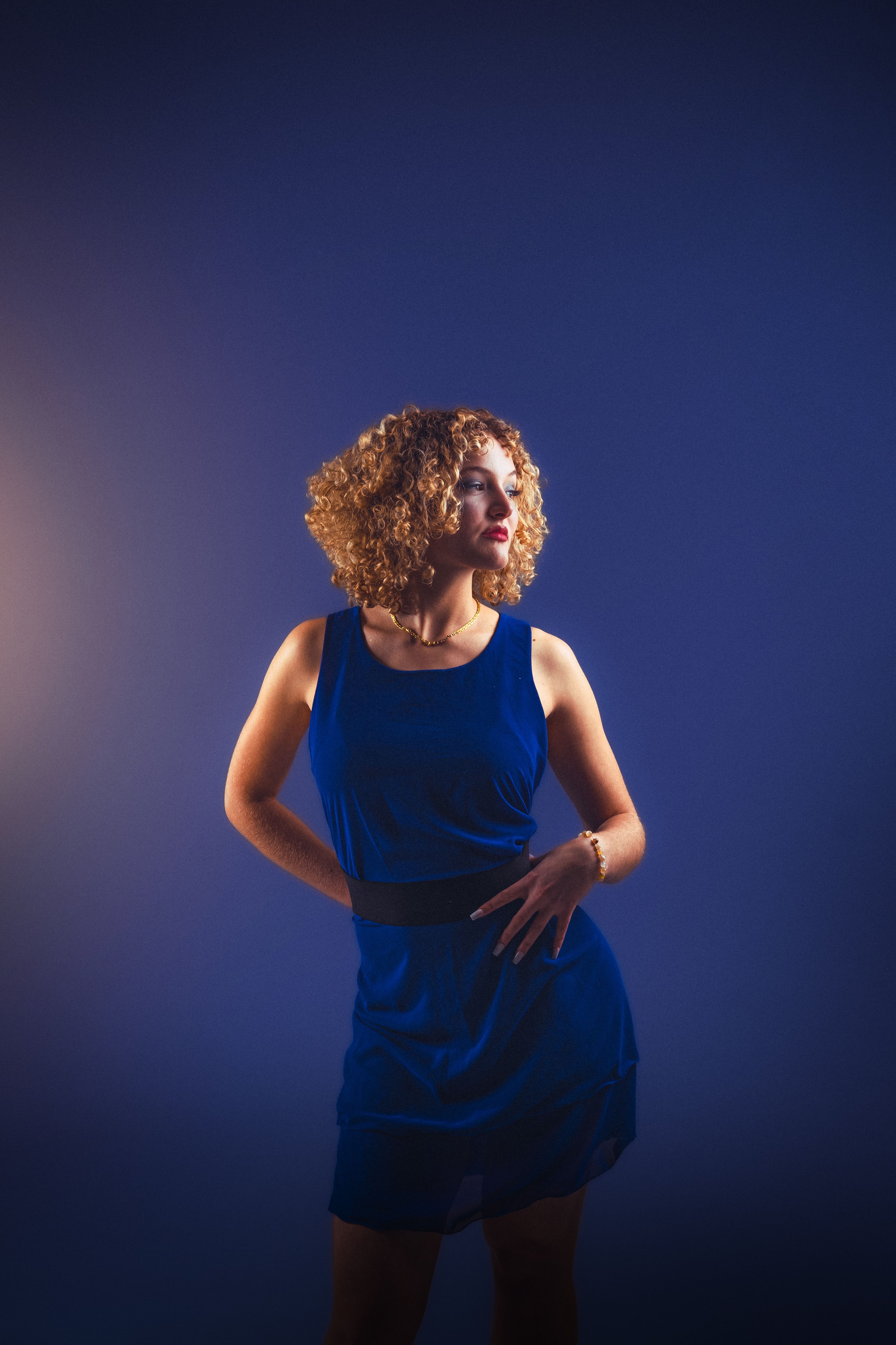 Elegant Studio Portrait of Woman in Blue Dress · Free Stock Photo