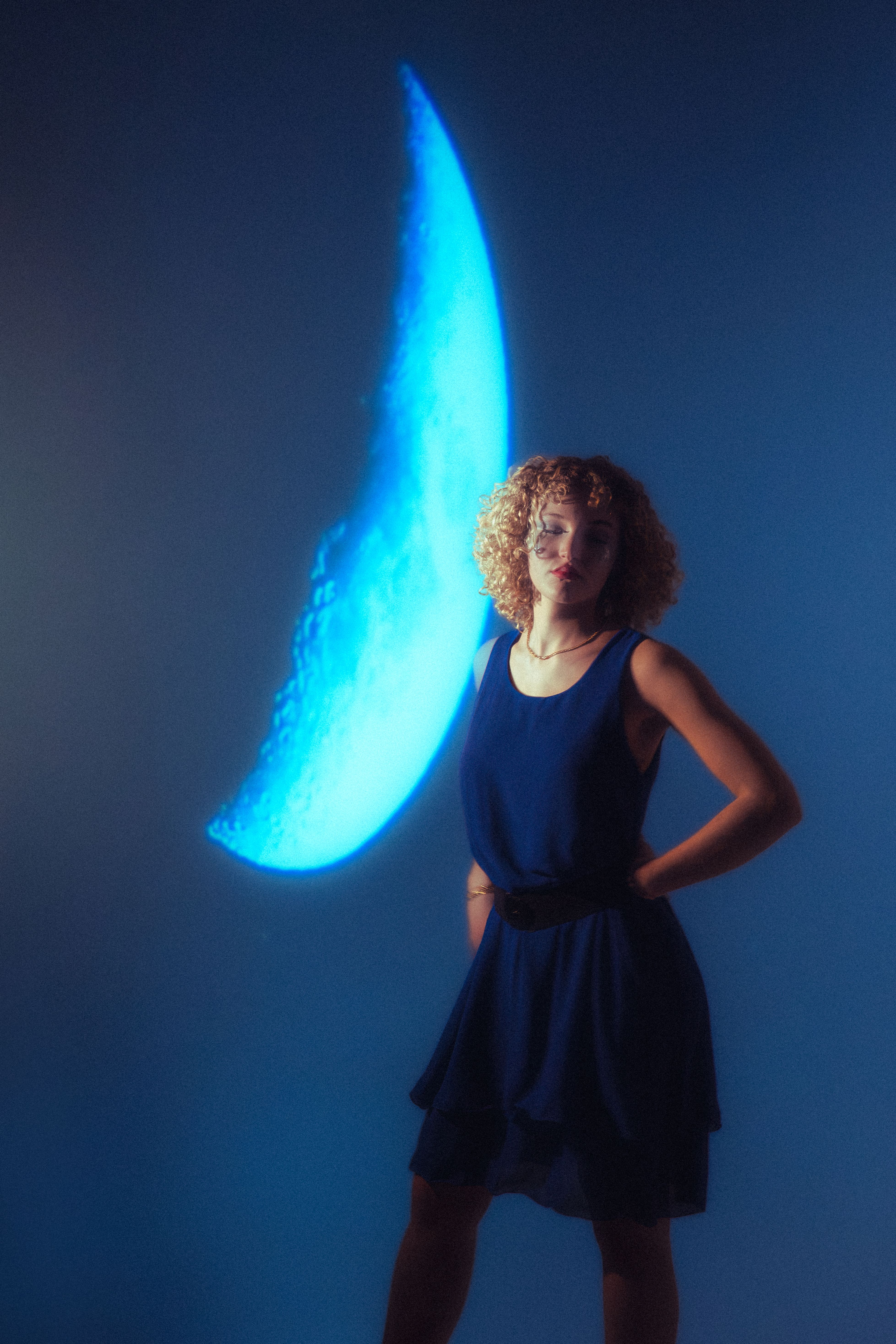 Artistic Portrait with Moon Projection on Blue Background · Free Stock ...