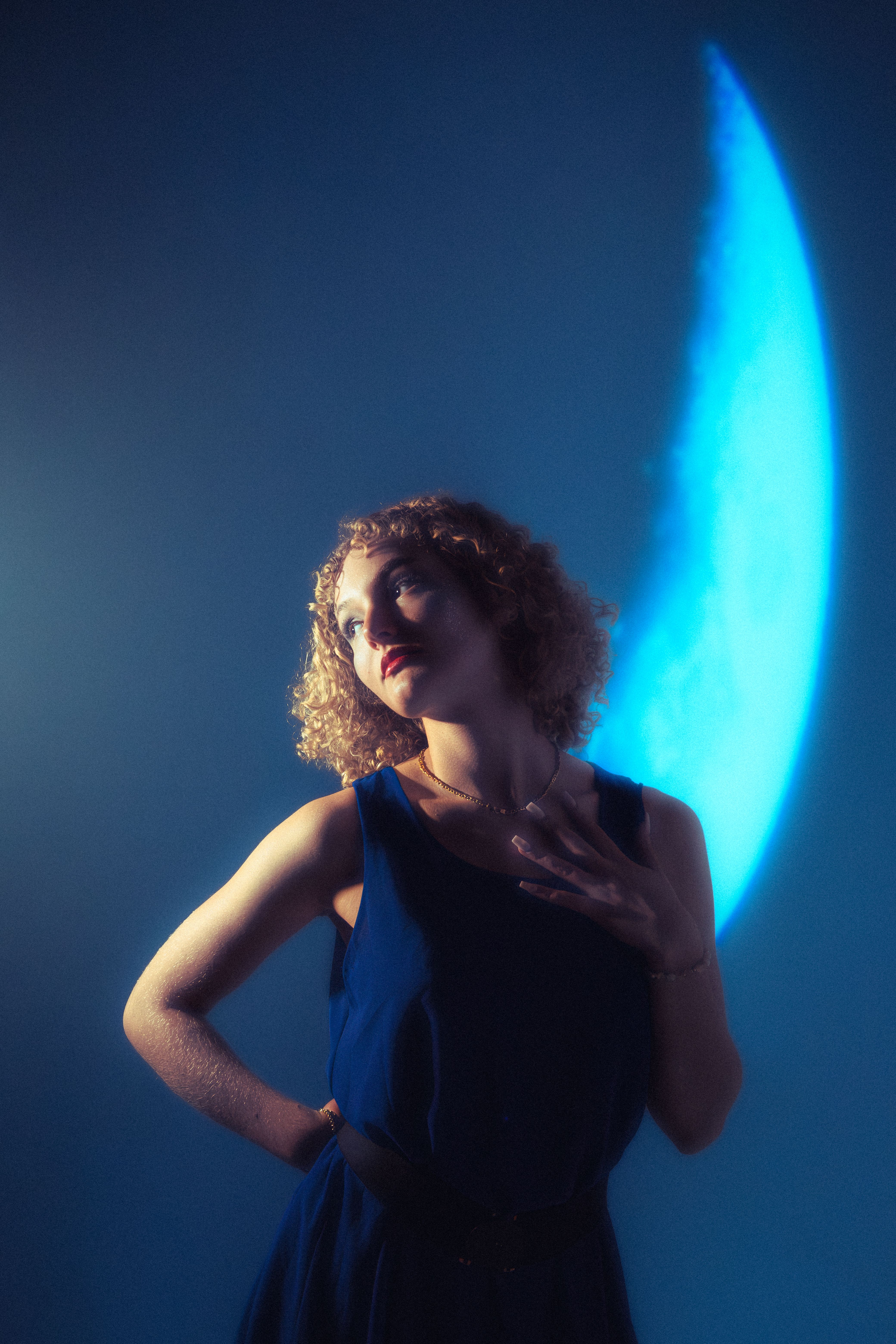 Artistic Portrait with Blue Moon Background · Free Stock Photo