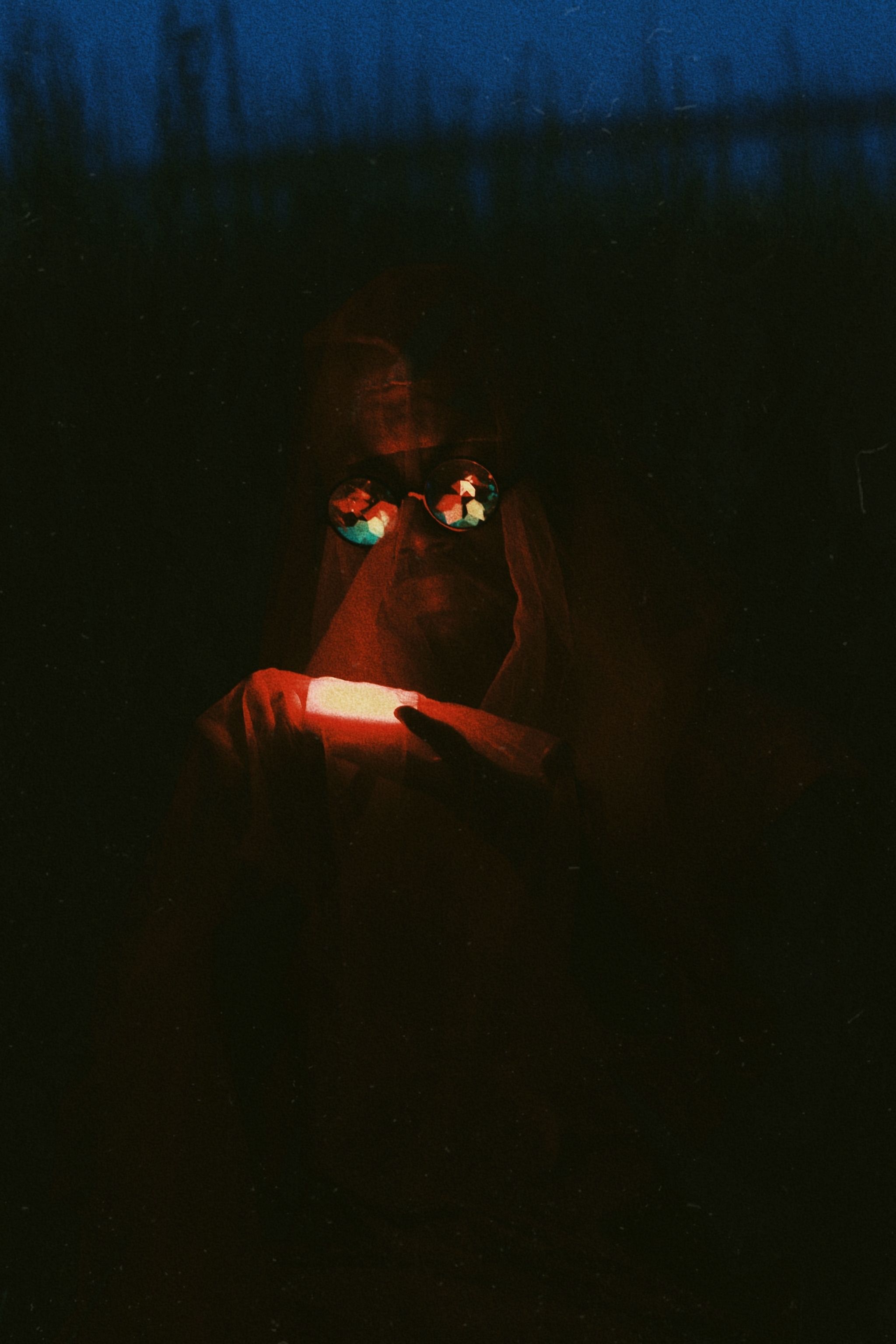 Mysterious Figure Holding Glowing Object at Night · Free Stock Photo