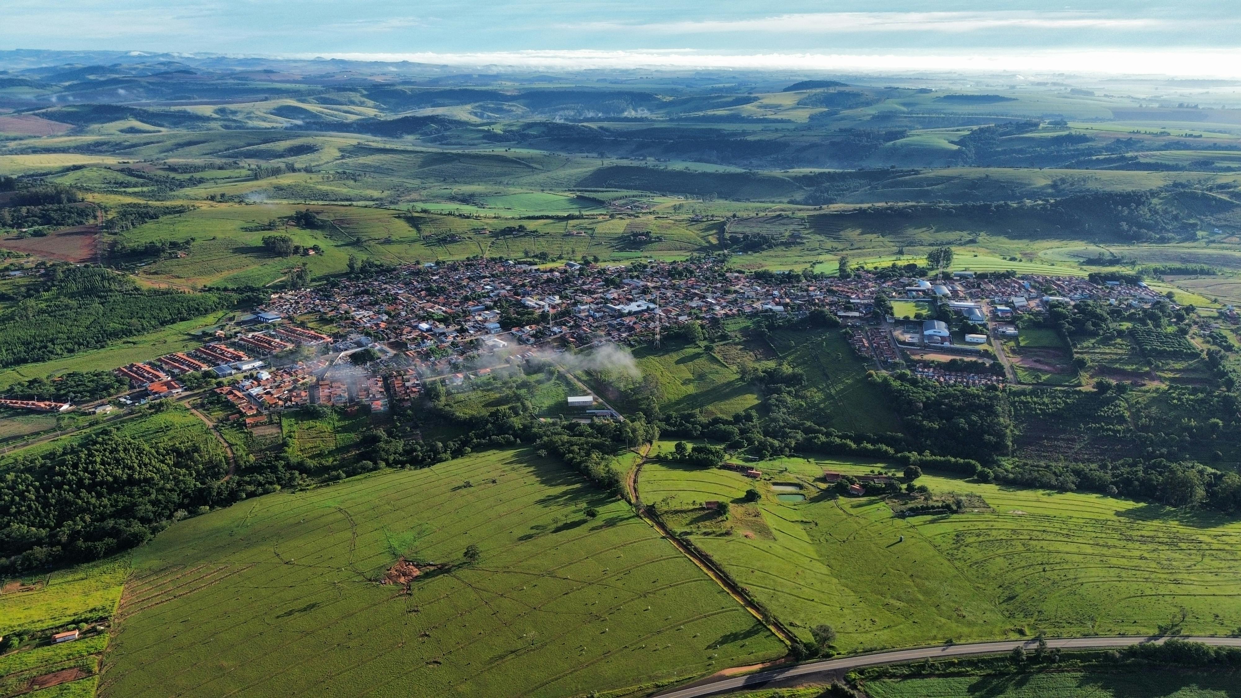 Aerial View of Rural Town in Verdant Landscape · Free Stock Photo