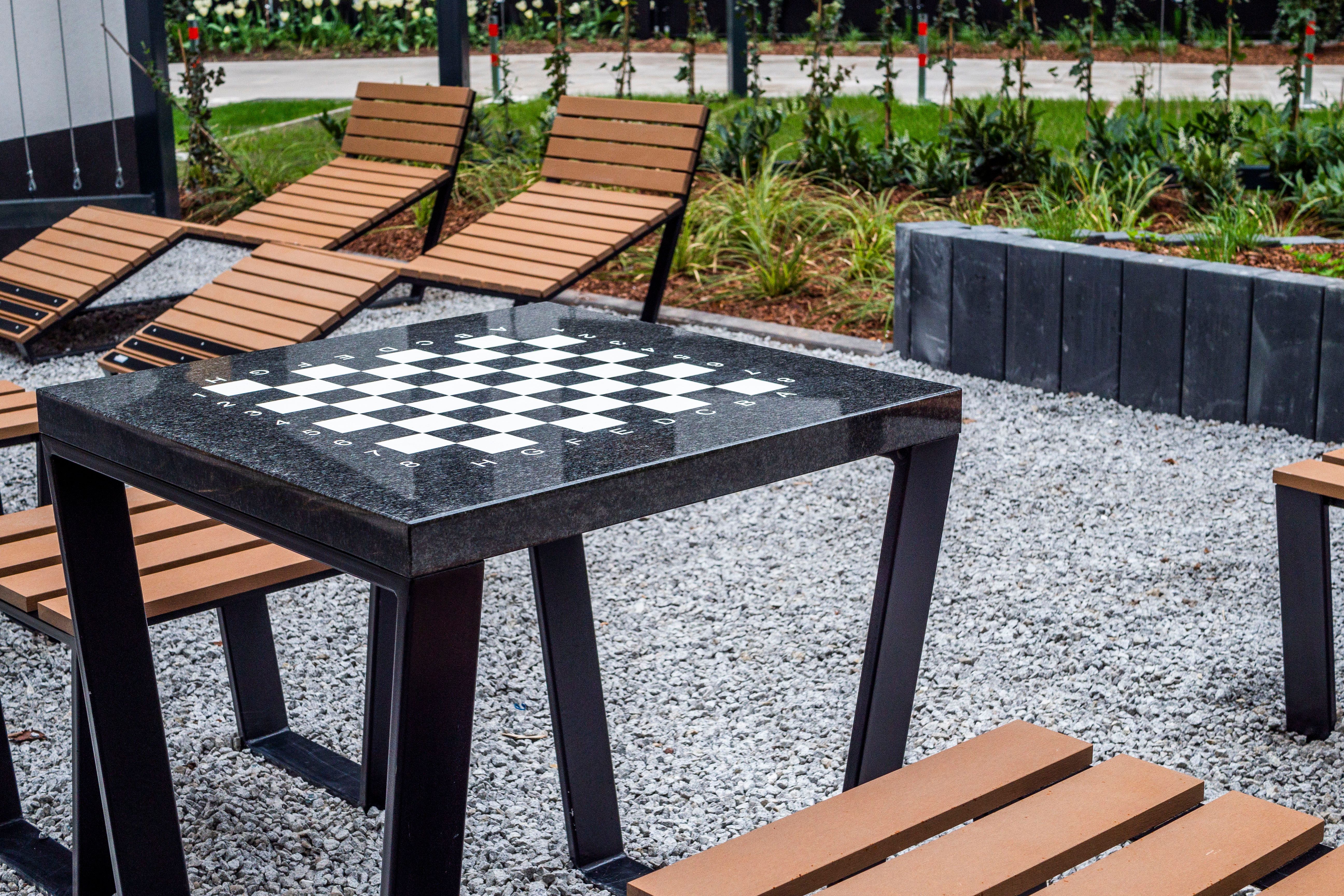 Outdoor Chess Table with Lounge Chairs · Free Stock Photo