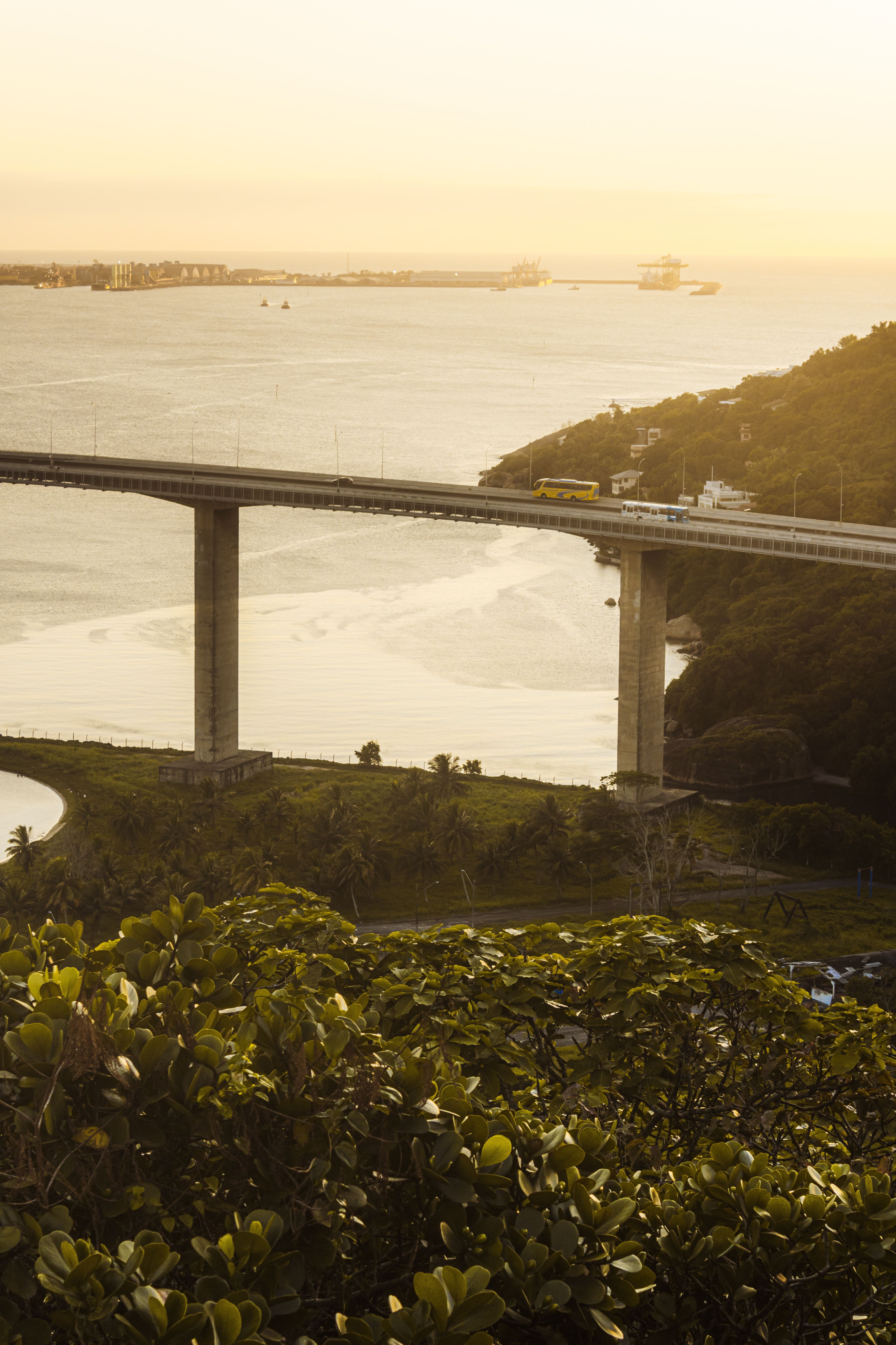 Sunset View of a Bridge Over Calm Waters · Free Stock Photo