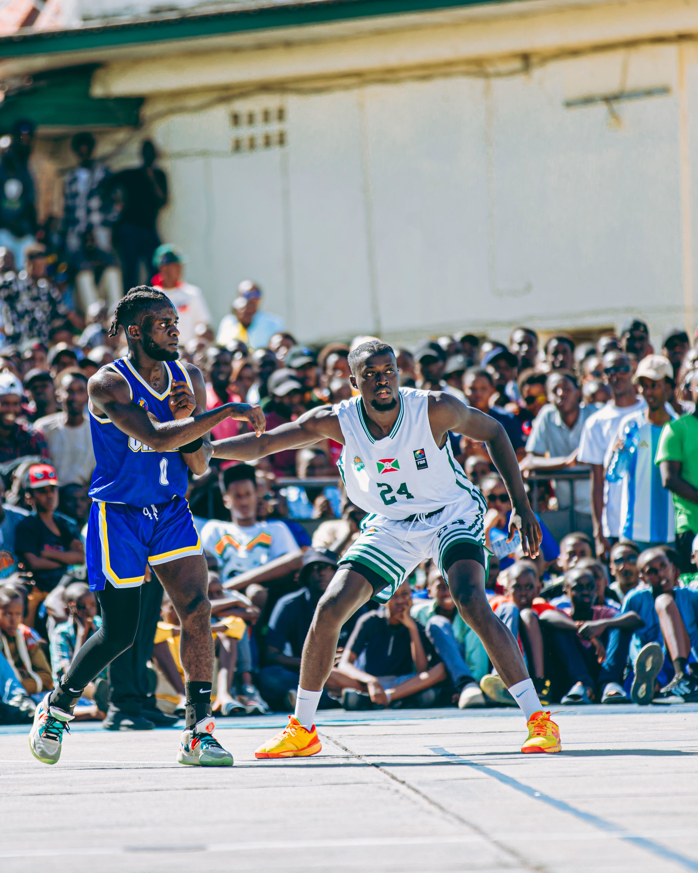 Intense Street Basketball Game with Energetic Crowd · Free Stock Photo