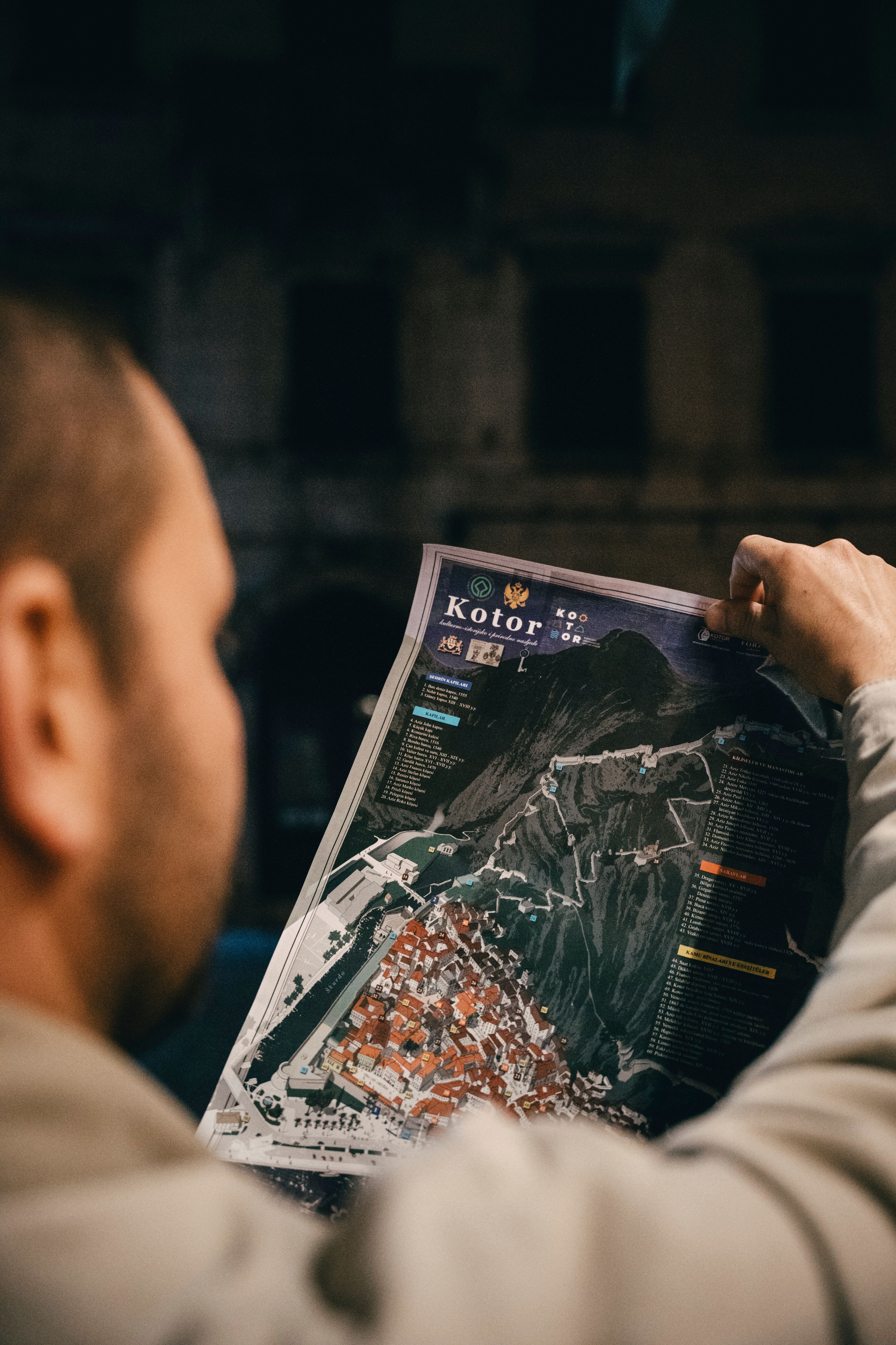 Tourist Exploring Kotor Map at Night · Free Stock Photo