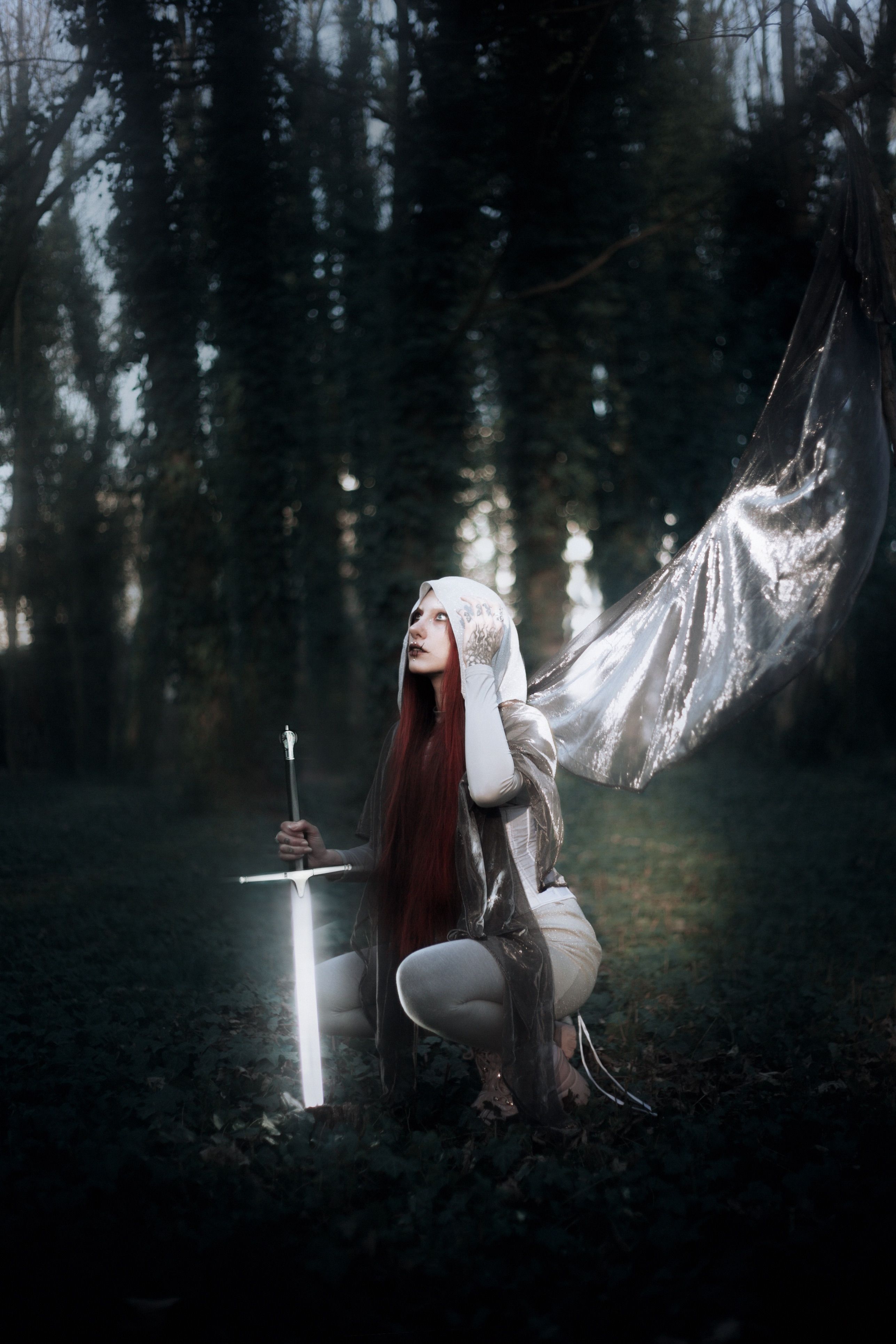 Mysterious Angel with Sword in Enchanted Forest · Free Stock Photo