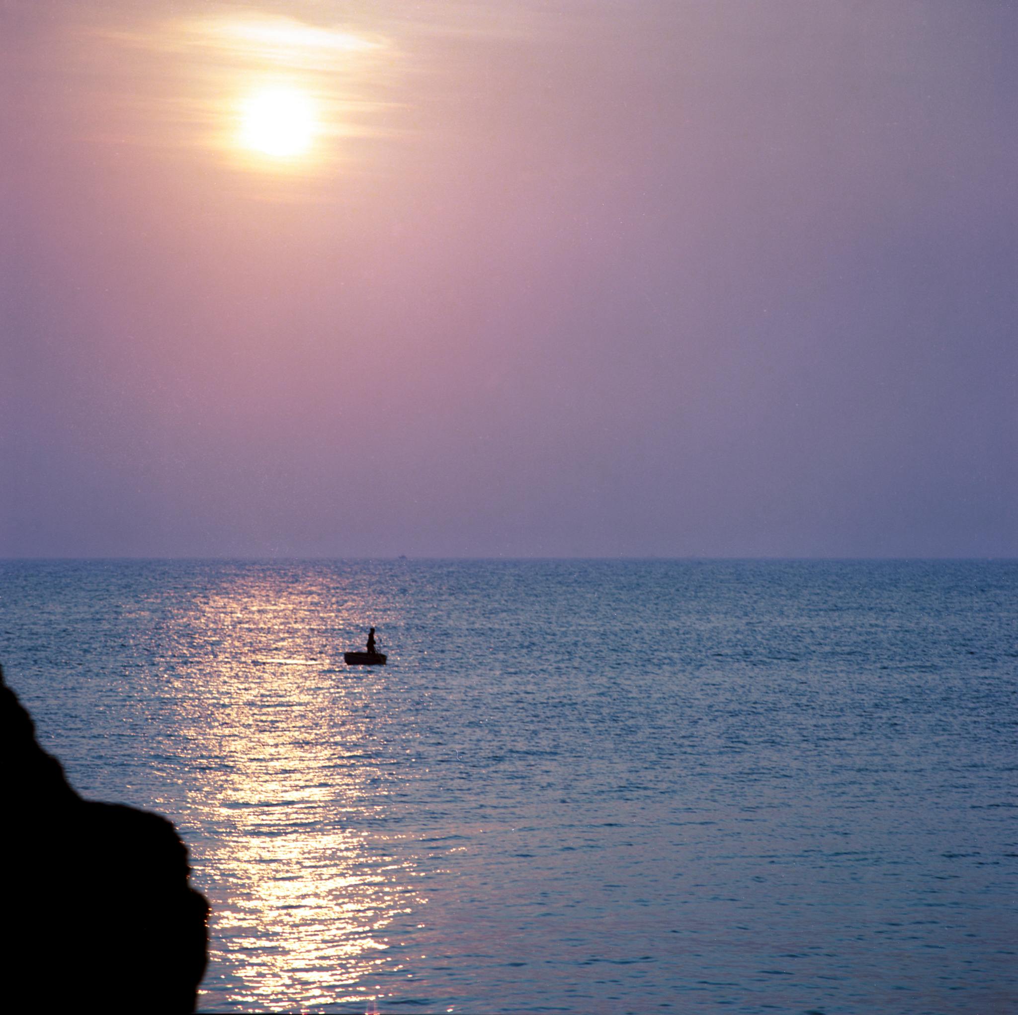 Sunset Fisherman on Tranquil Ocean in Quang Ngai · Free Stock Photo