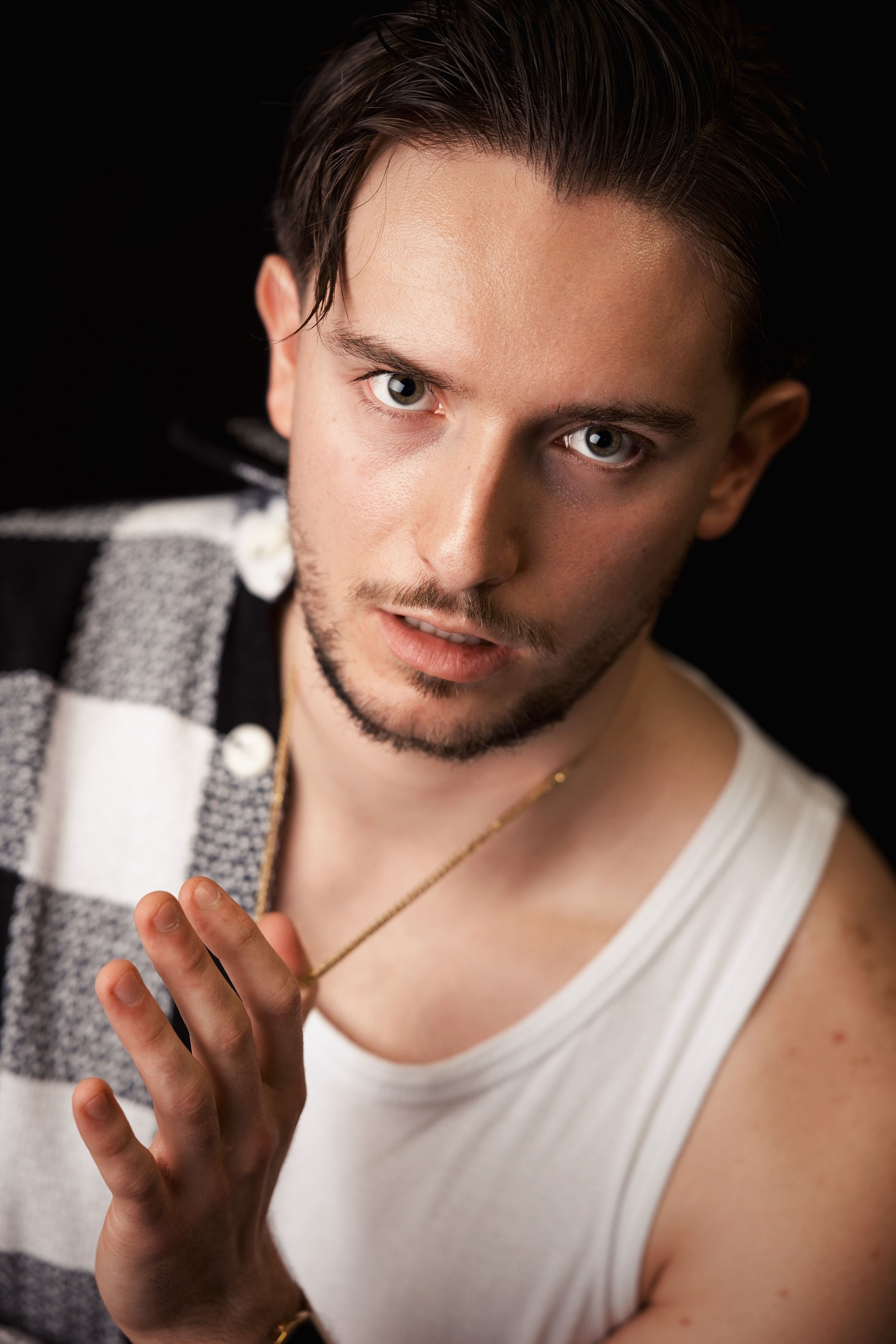 Dramatic Portrait of a Young Man with a Bold Look · Free Stock Photo