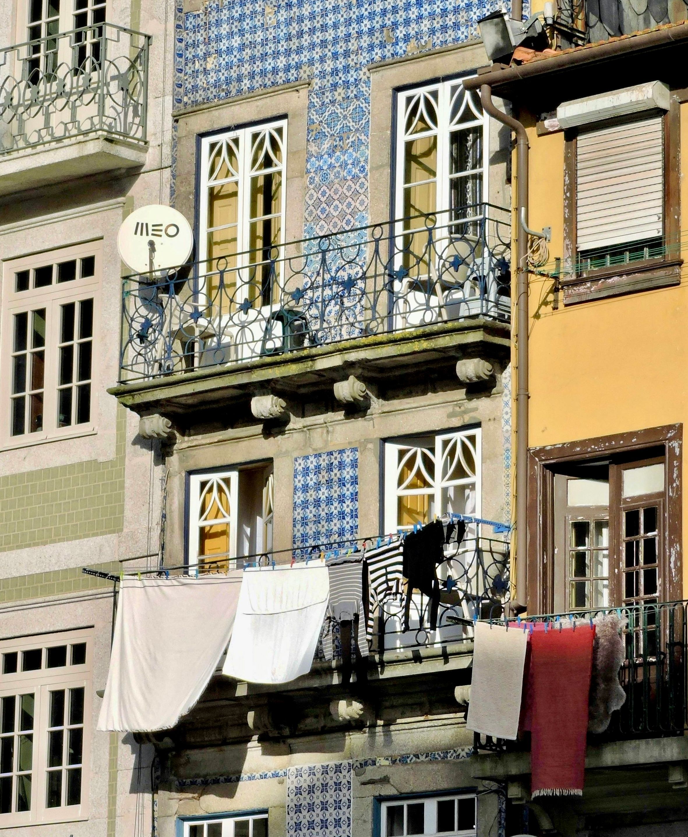 Colorful European Building Facade With Laundry · Free Stock Photo