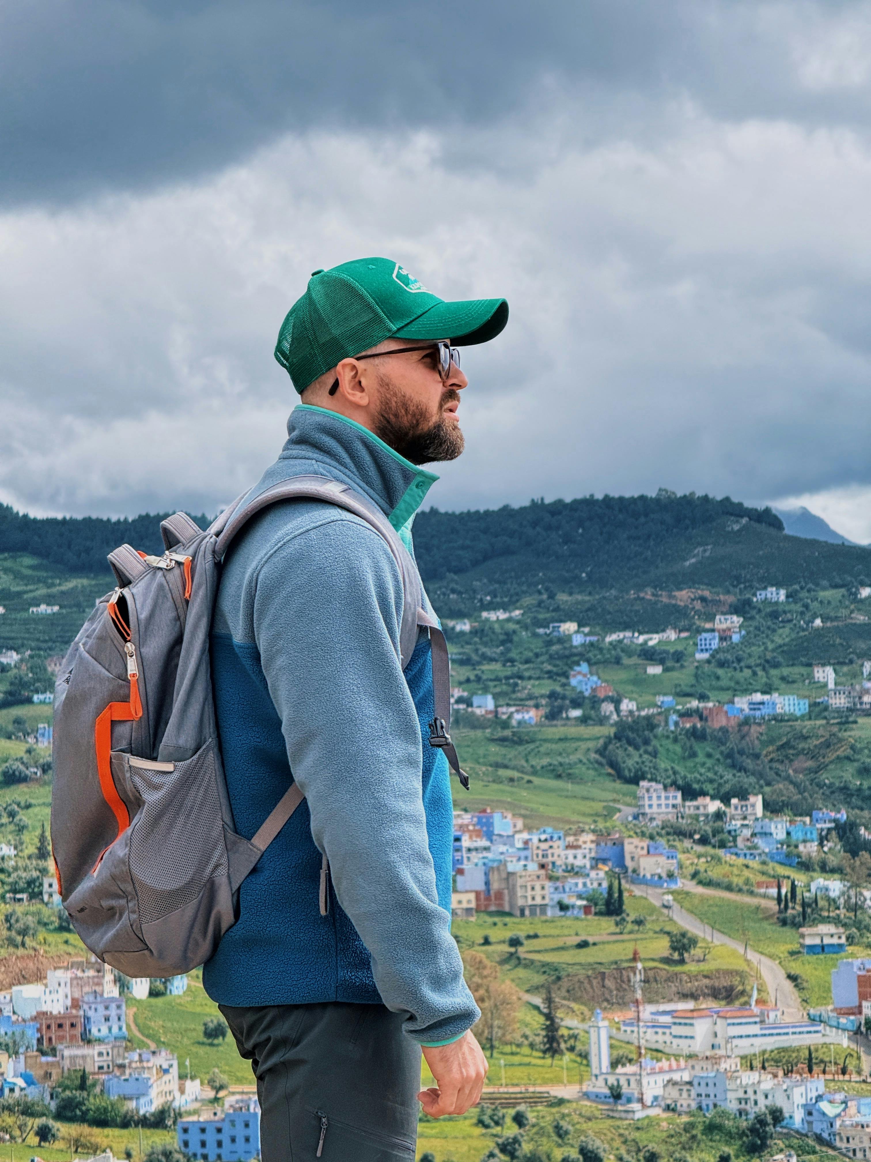 Man Hiking with Backpack in Scenic Mountain View · Free Stock Photo