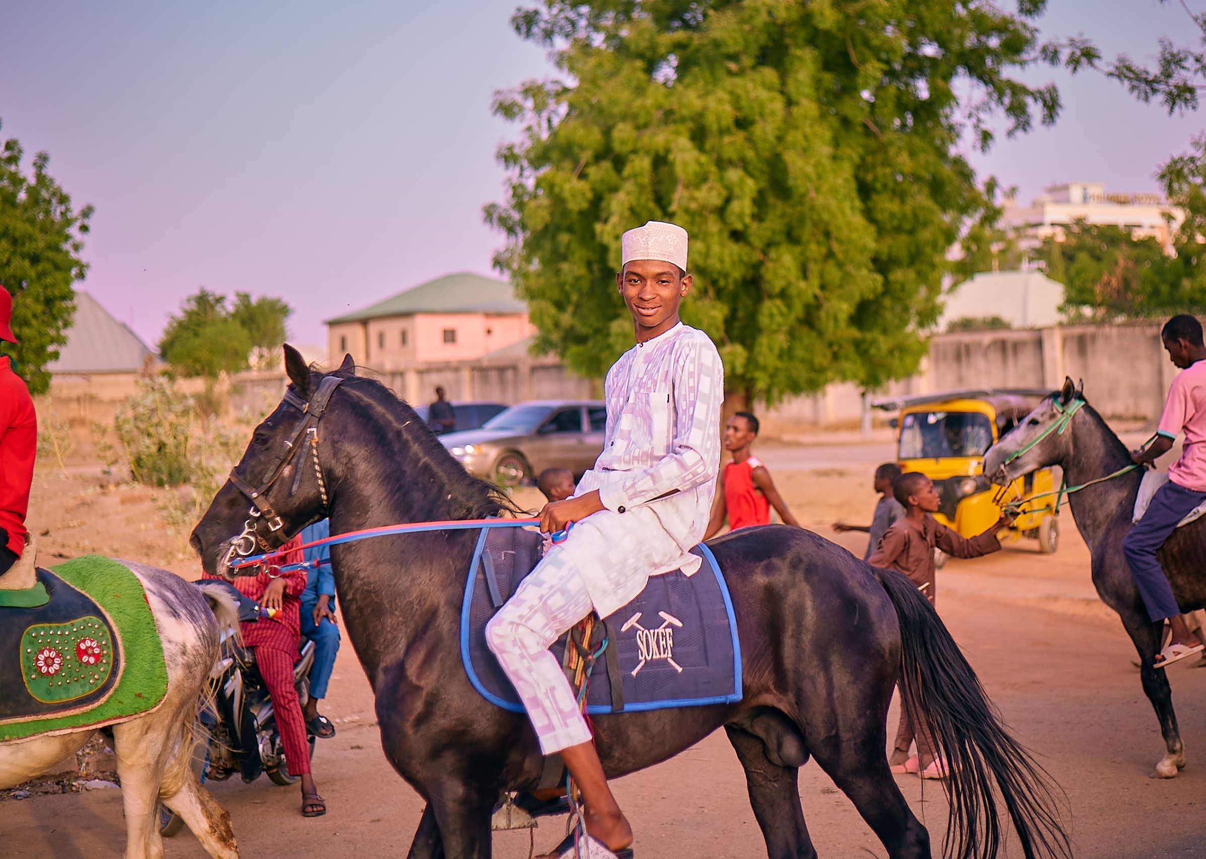 Joyful Horse Riding Scene in Urban Setting · Free Stock Photo