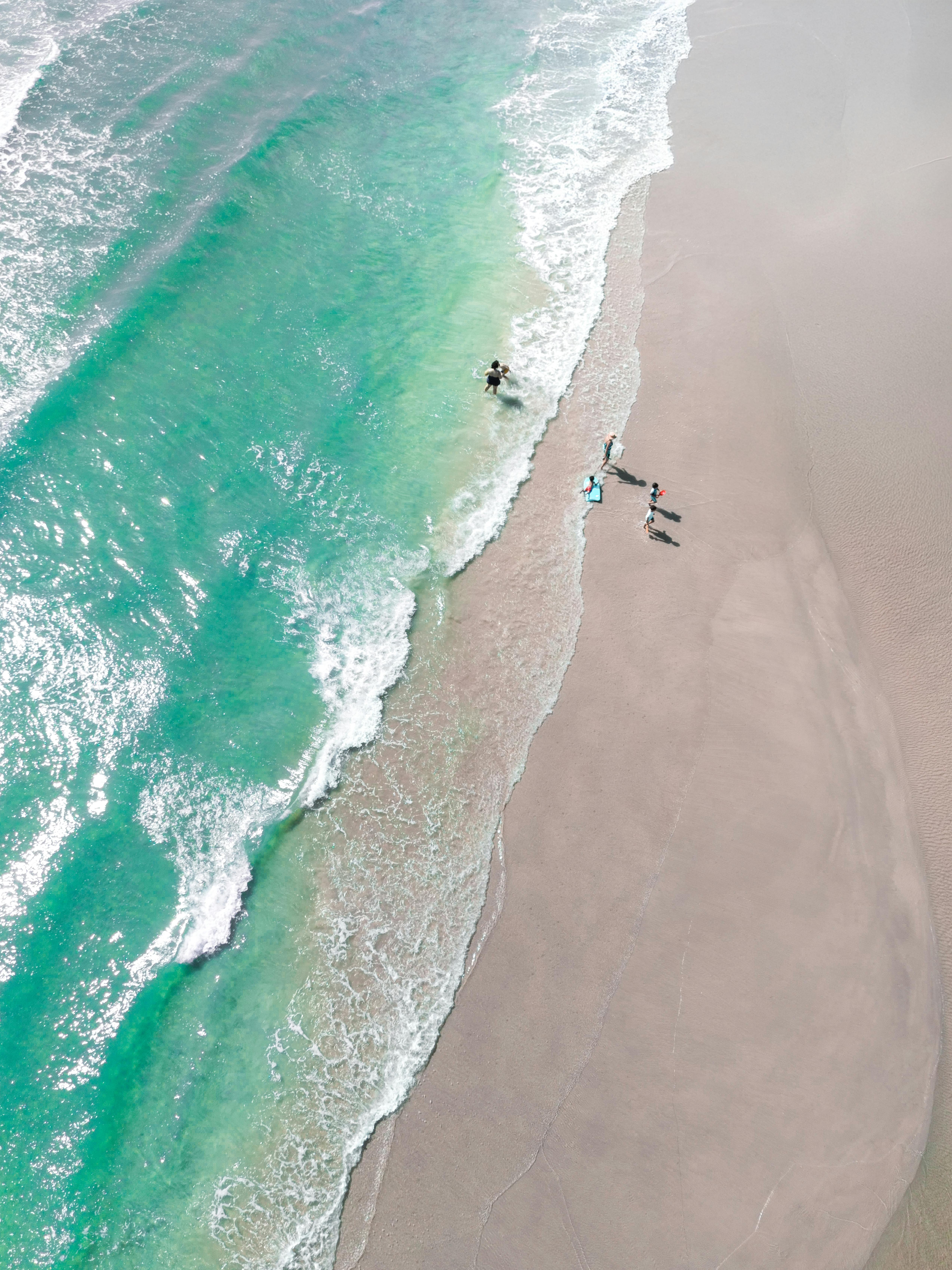 Aerial View of a Serene Beach Day Scene · Free Stock Photo