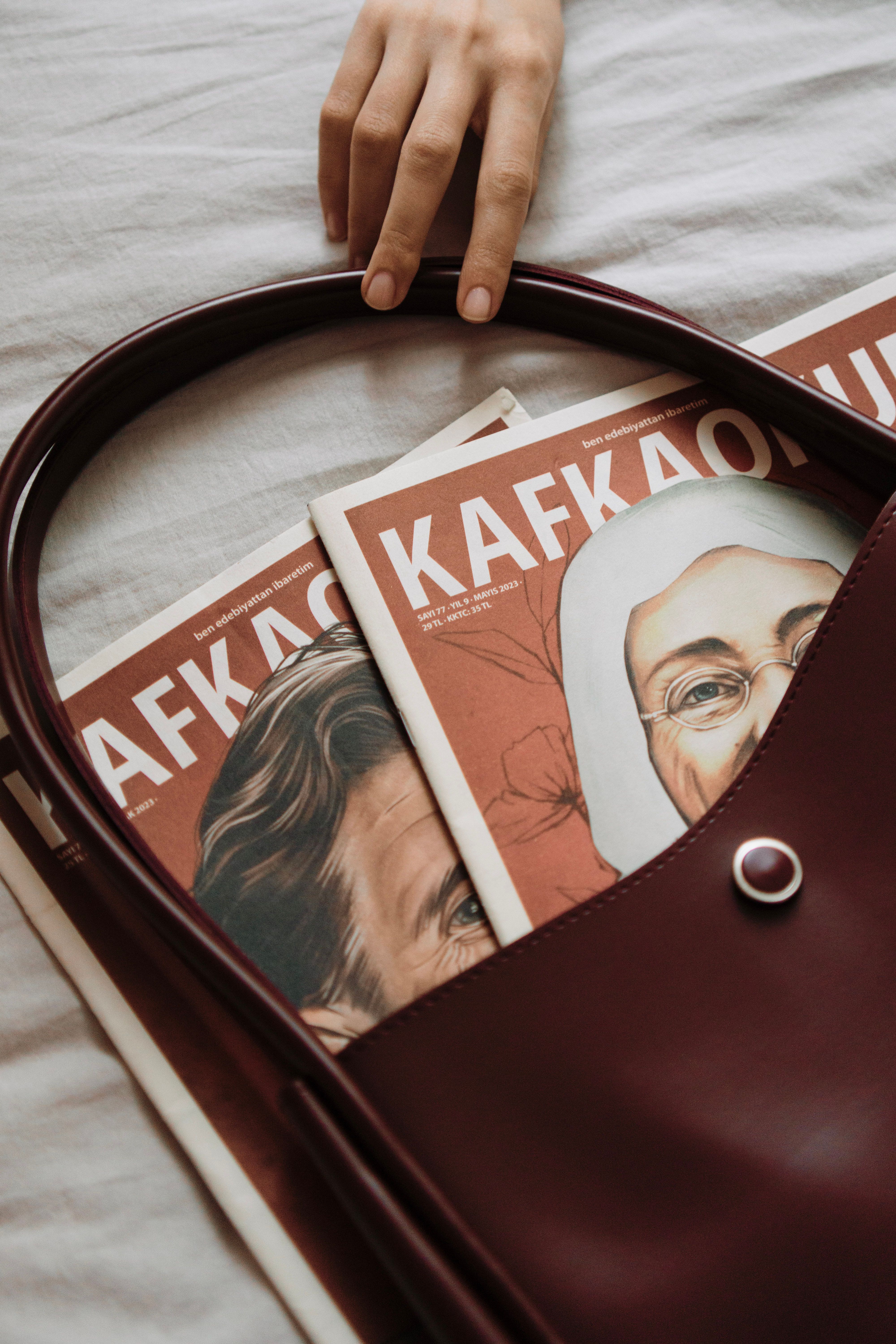 Stylish Leather Bag with Kafka Magazine Interior · Free Stock Photo