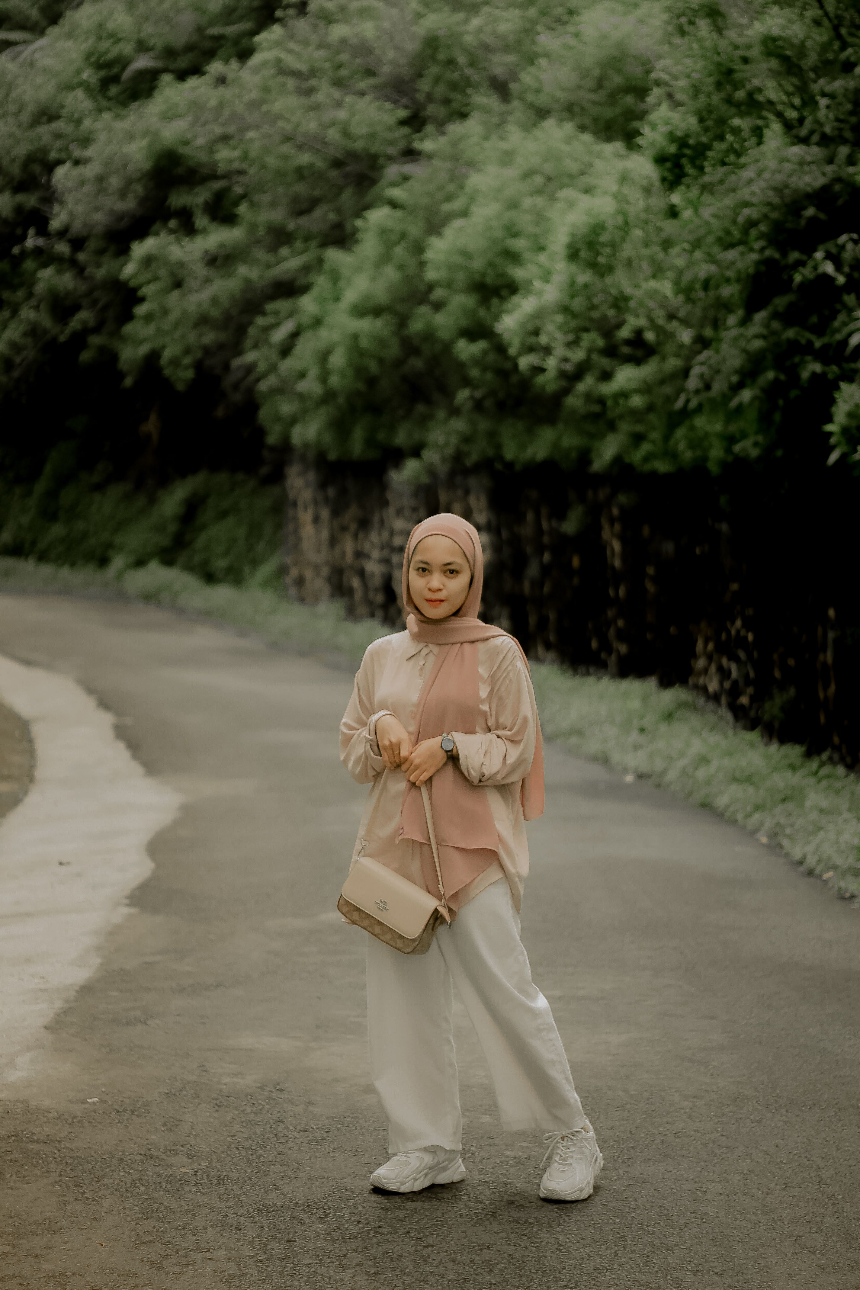 Stylish Muslim Woman Walking Outdoors in Indonesia · Free Stock Photo