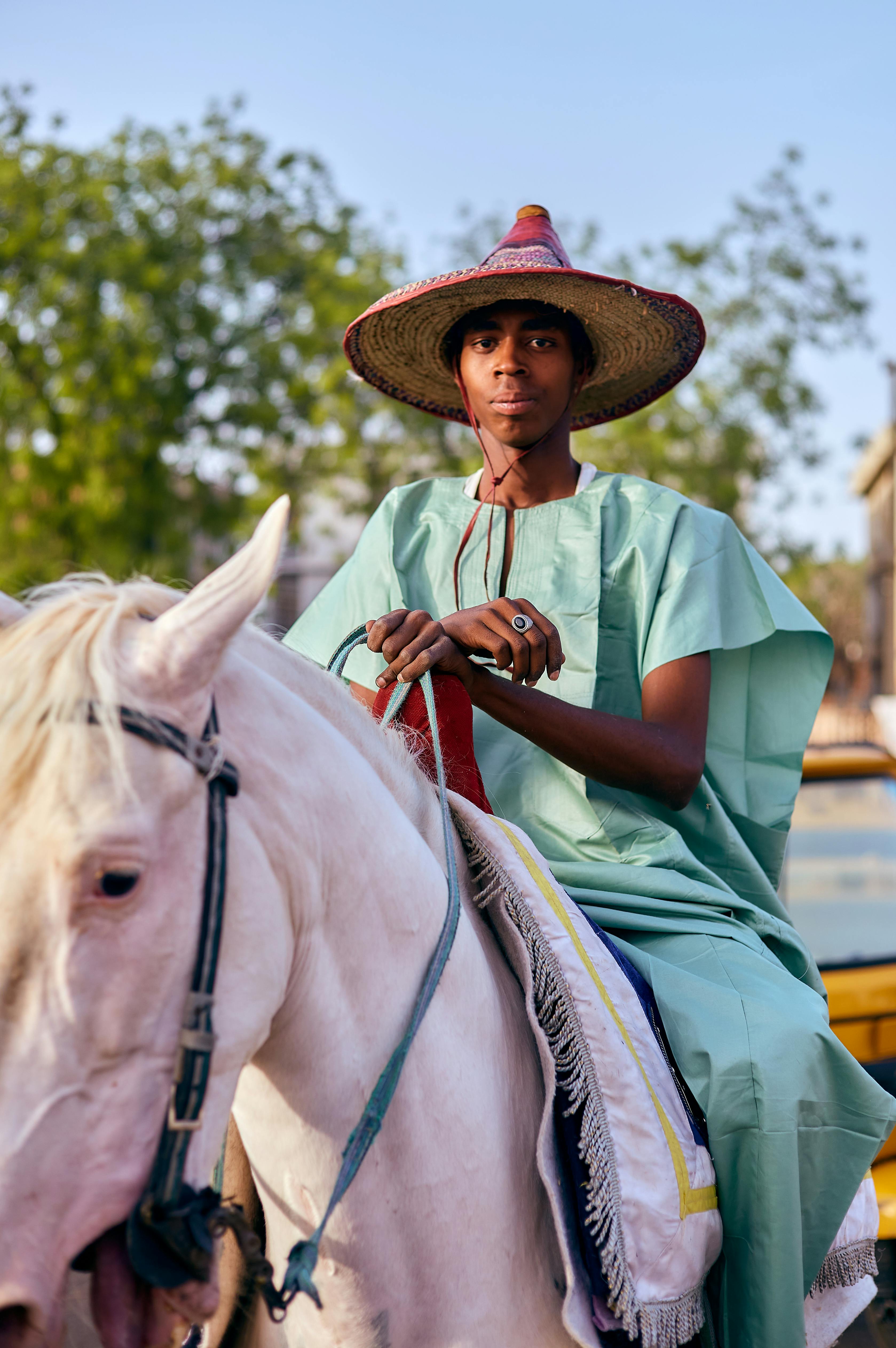 Traditional Horseman in African Attire and Hat · Free Stock Photo