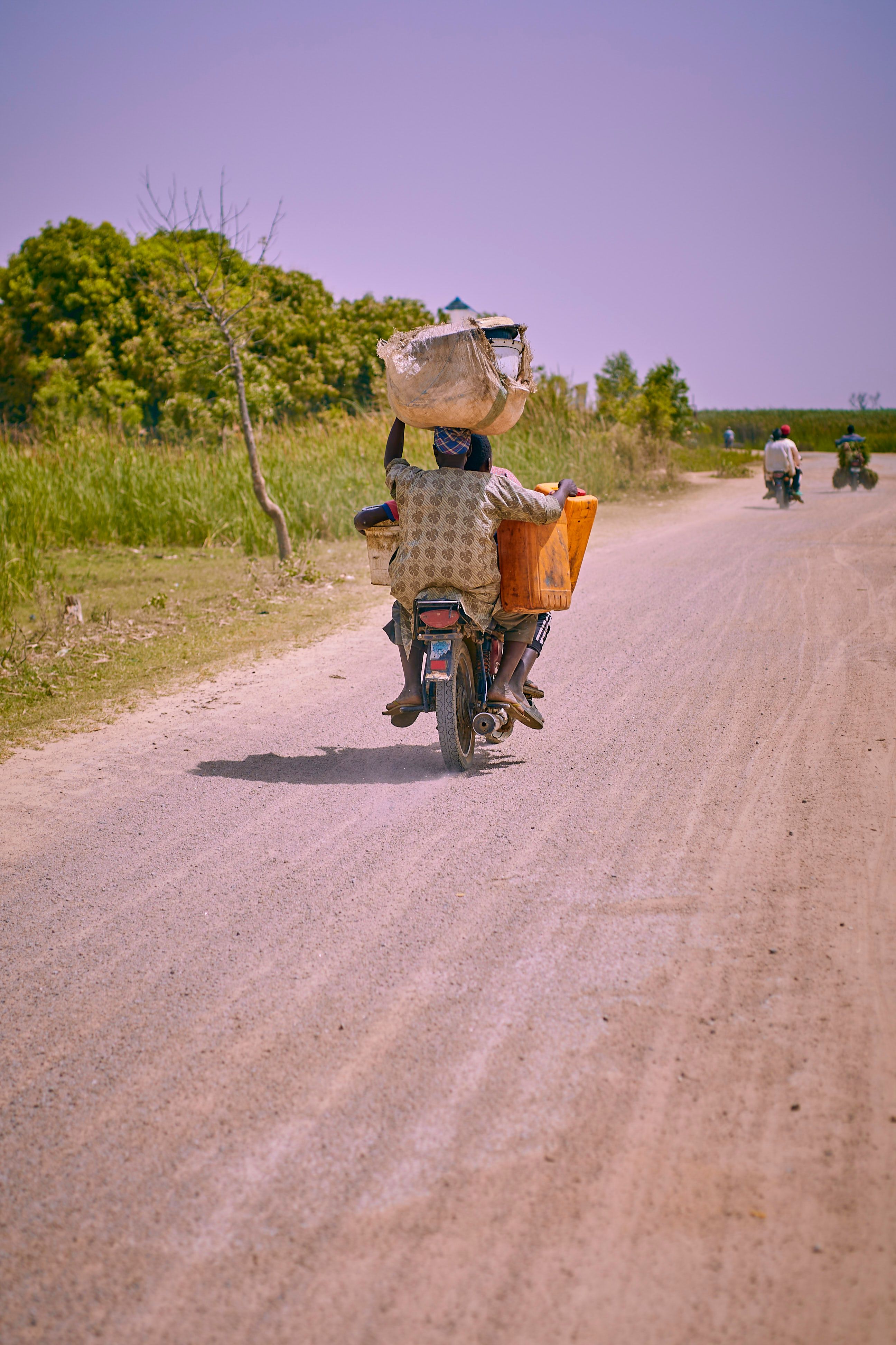 Rural Motorcycle Journey with Balanced Load · Free Stock Photo
