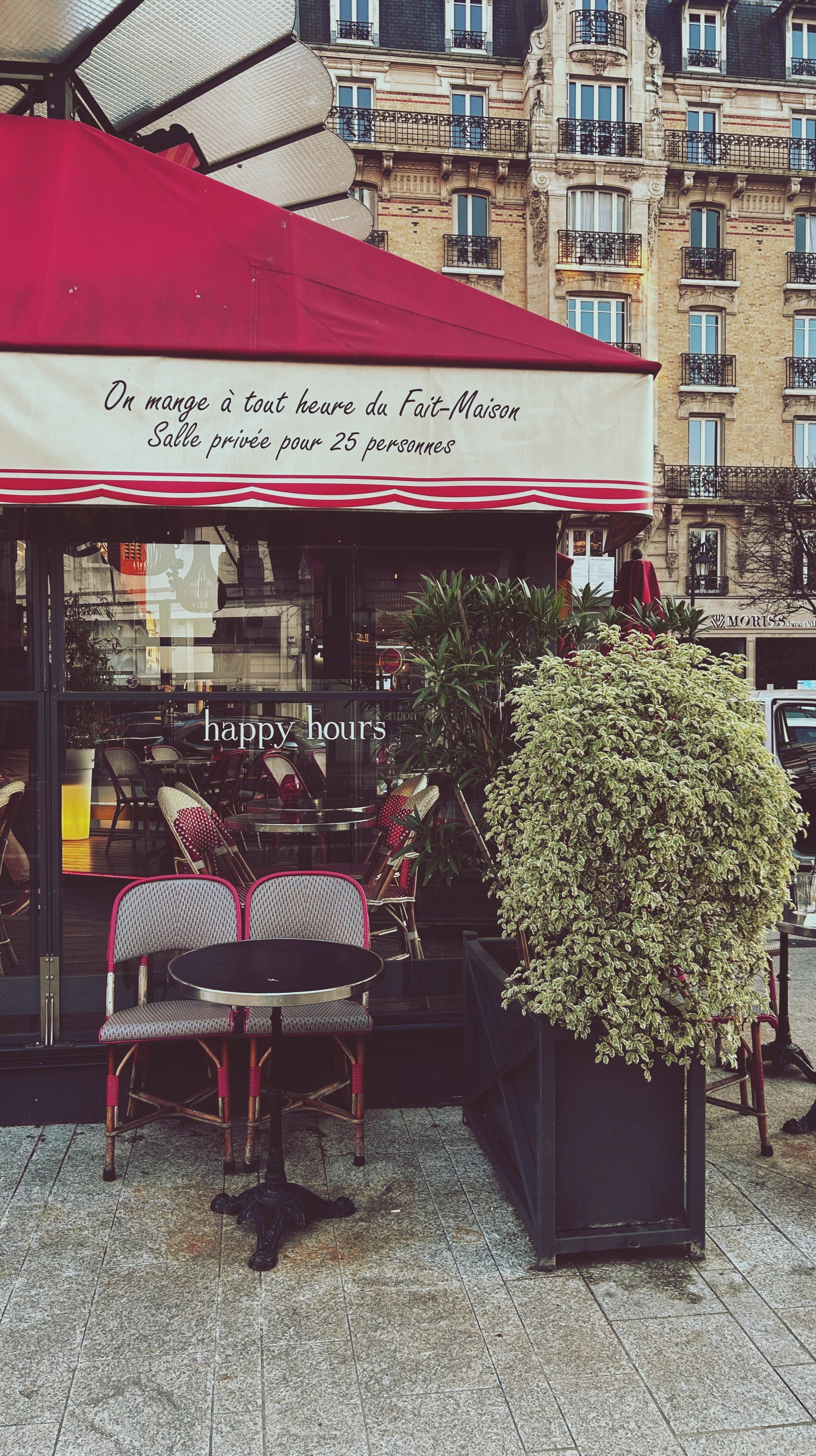Charming Outdoor Parisian Café with Red Canopy · Free Stock Photo
