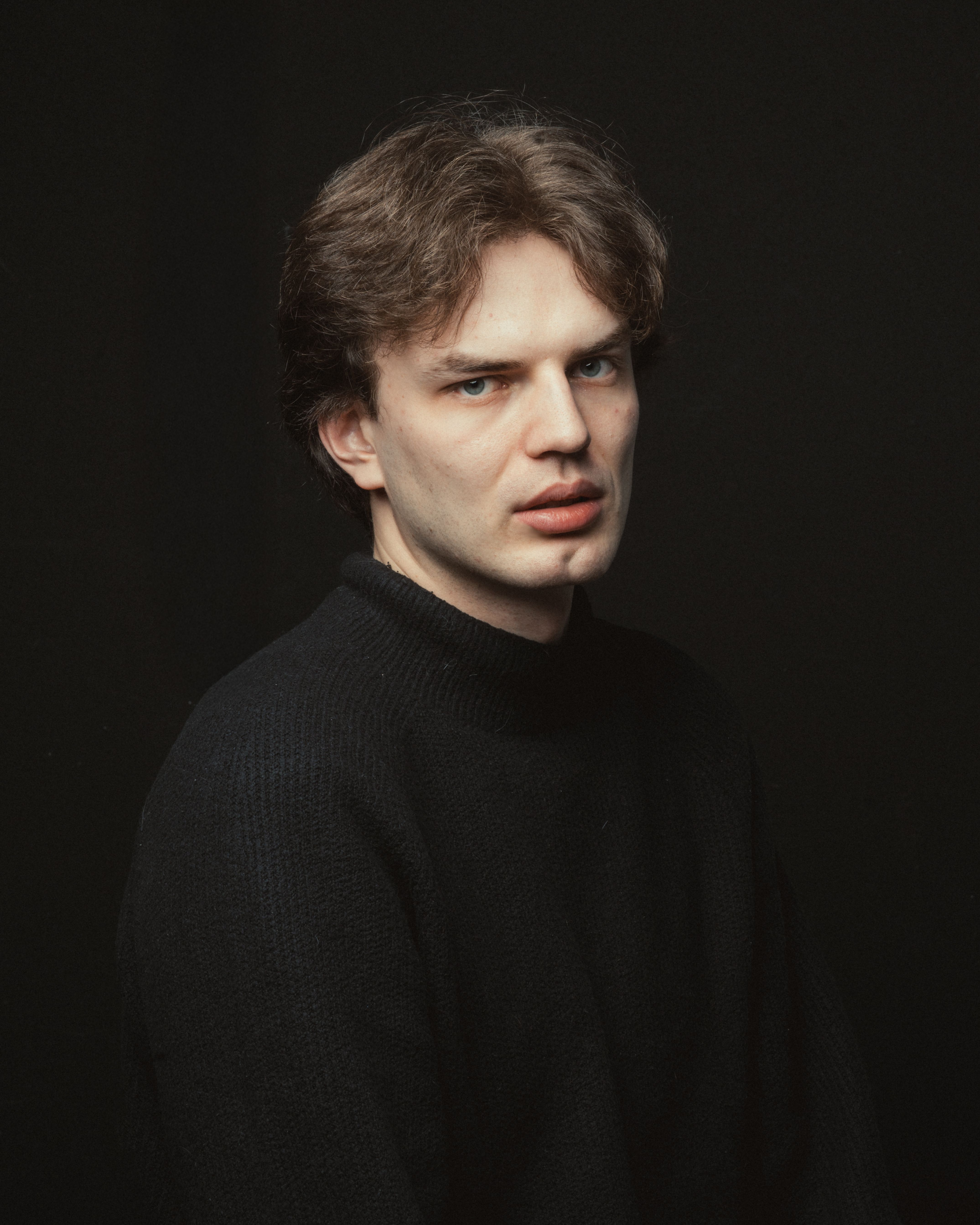 Moody Portrait of a Young Man in Black · Free Stock Photo