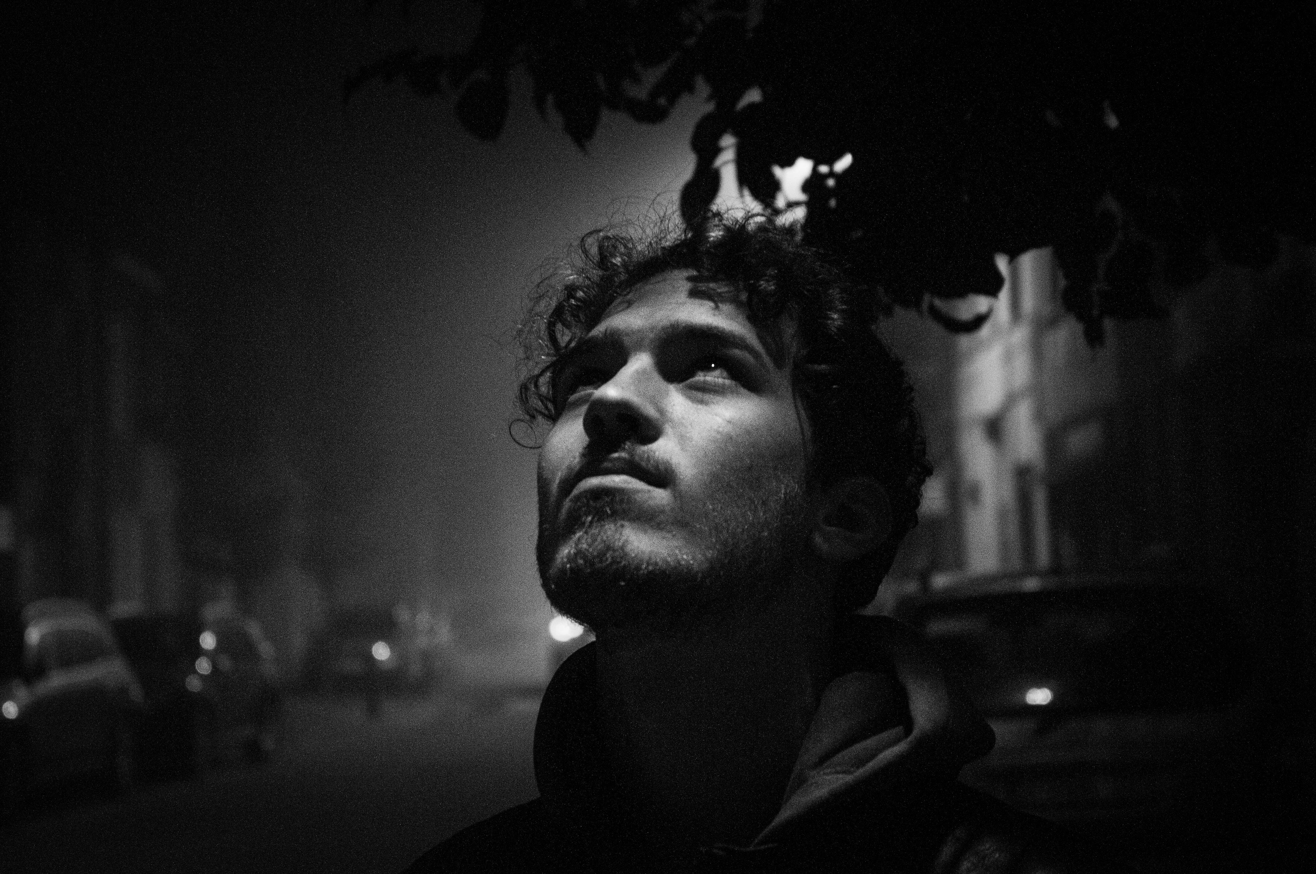 Brooding Black and White Street Portrait at Night · Free Stock Photo