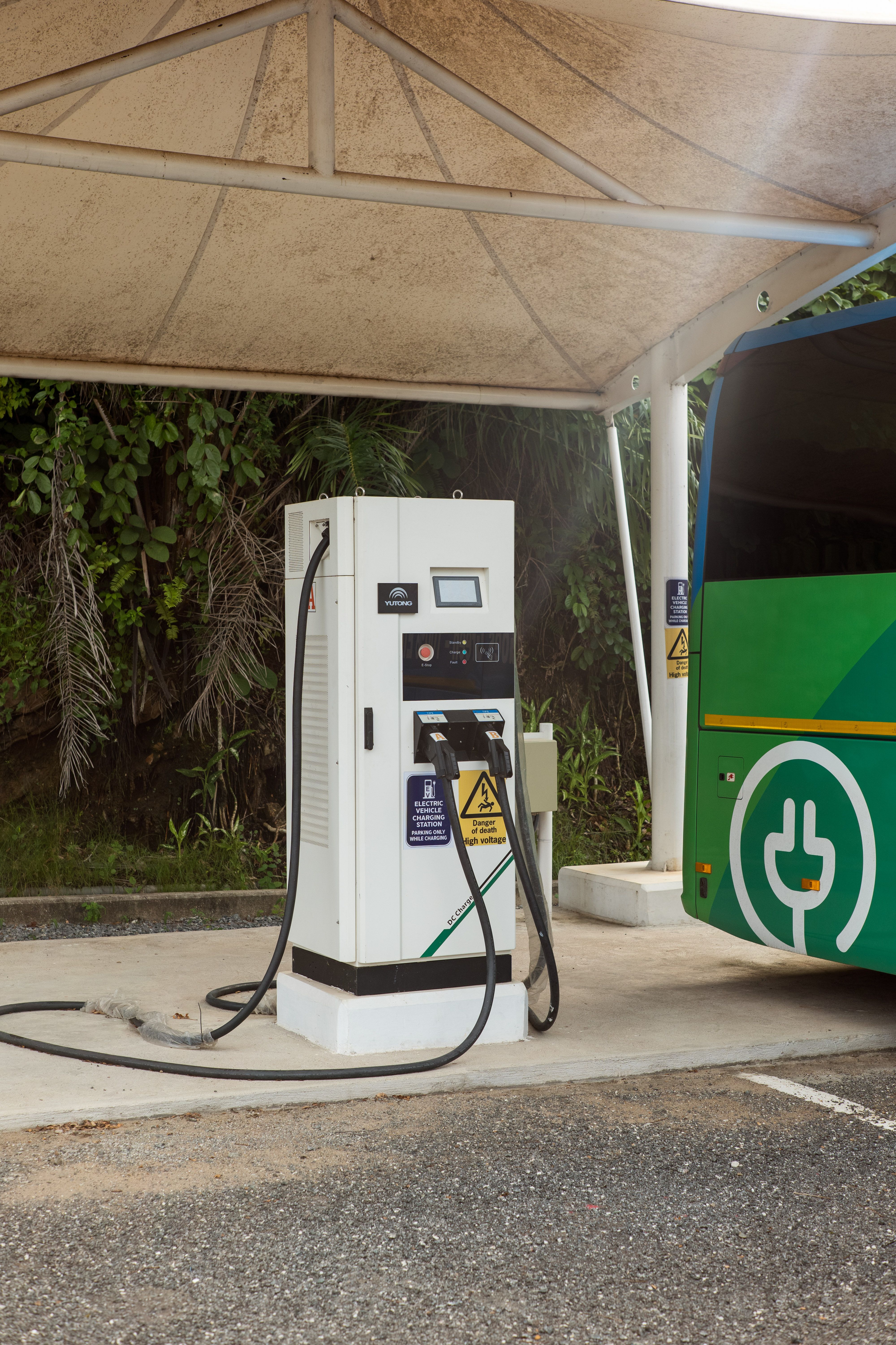 Electric Bus Charging Station in Outdoor Setting · Free Stock Photo
