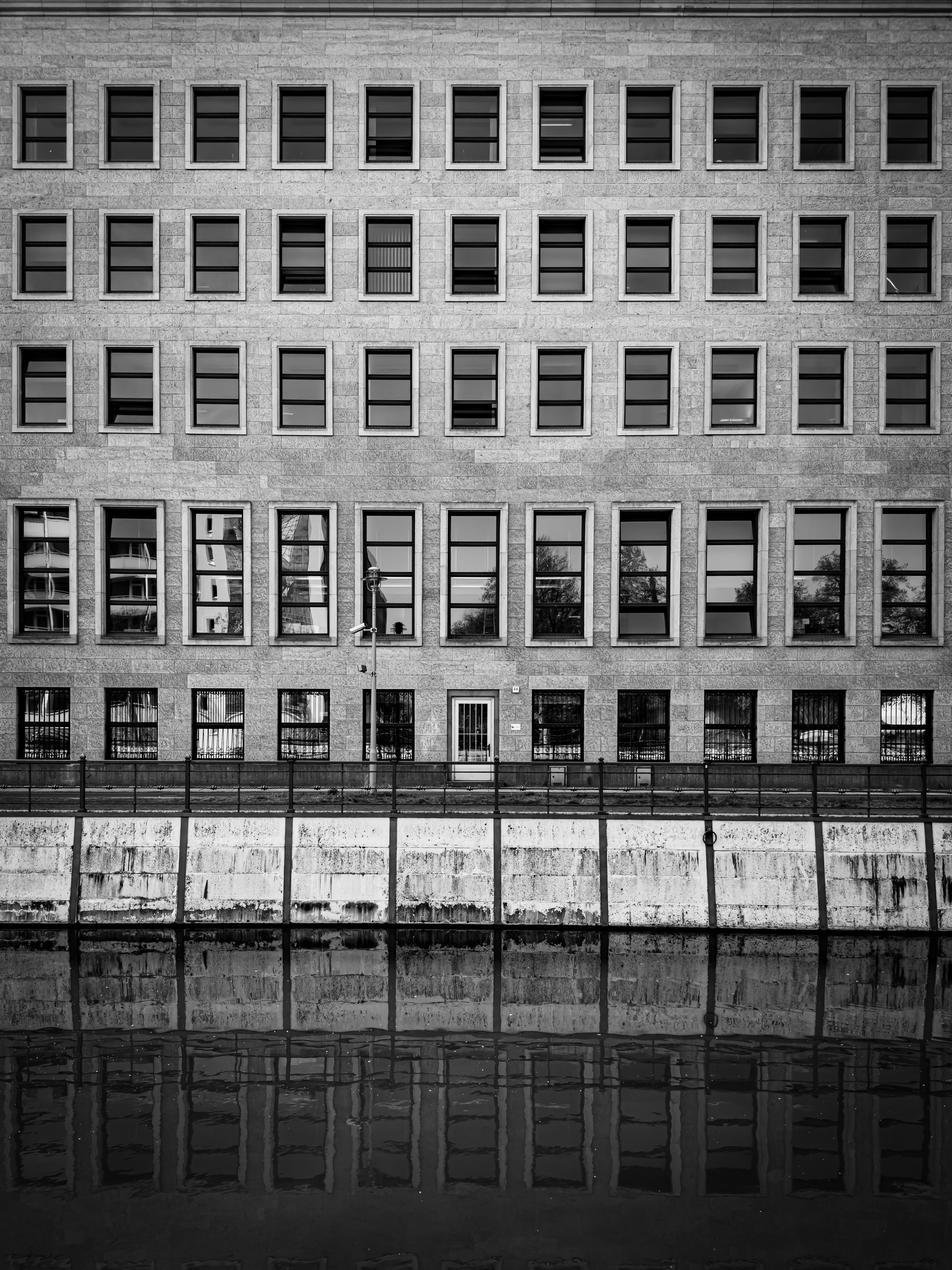 Symmetrical Building Reflection in Berlin's Canal · Free Stock Photo