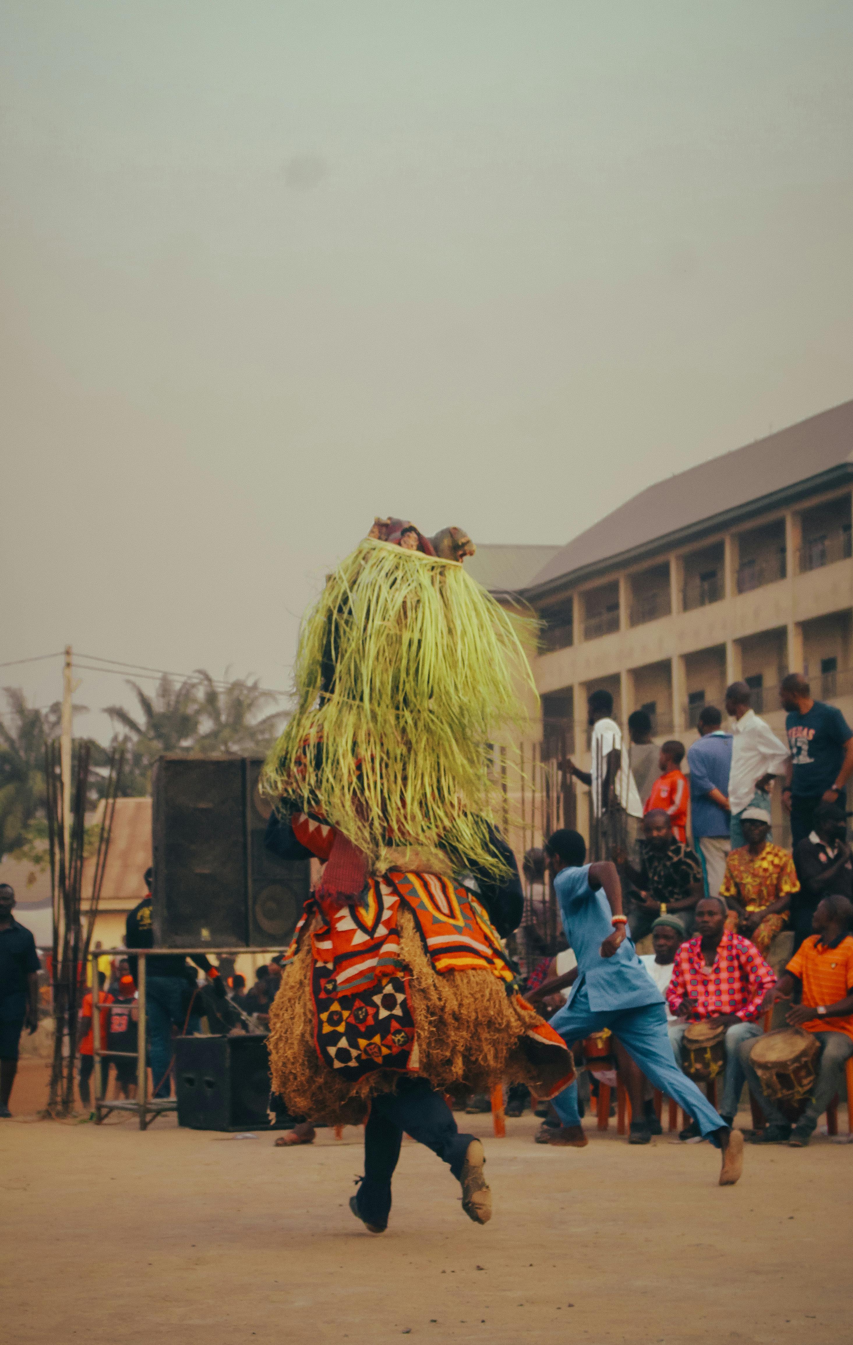 Vibrant Nigerian Masquerade Dance Celebration · Free Stock Photo