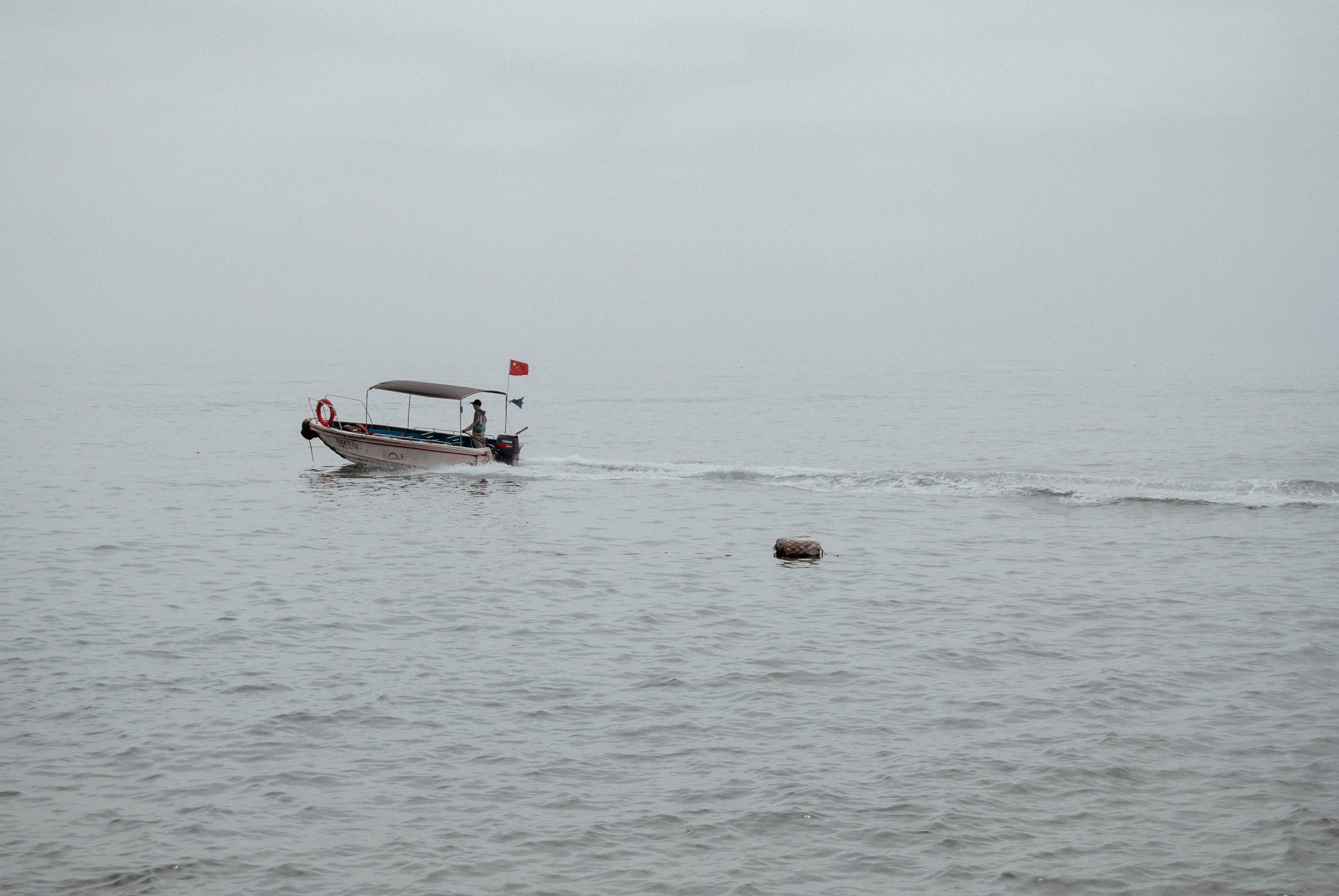 Serene Boat Ride in Shenzhen Waters · Free Stock Photo