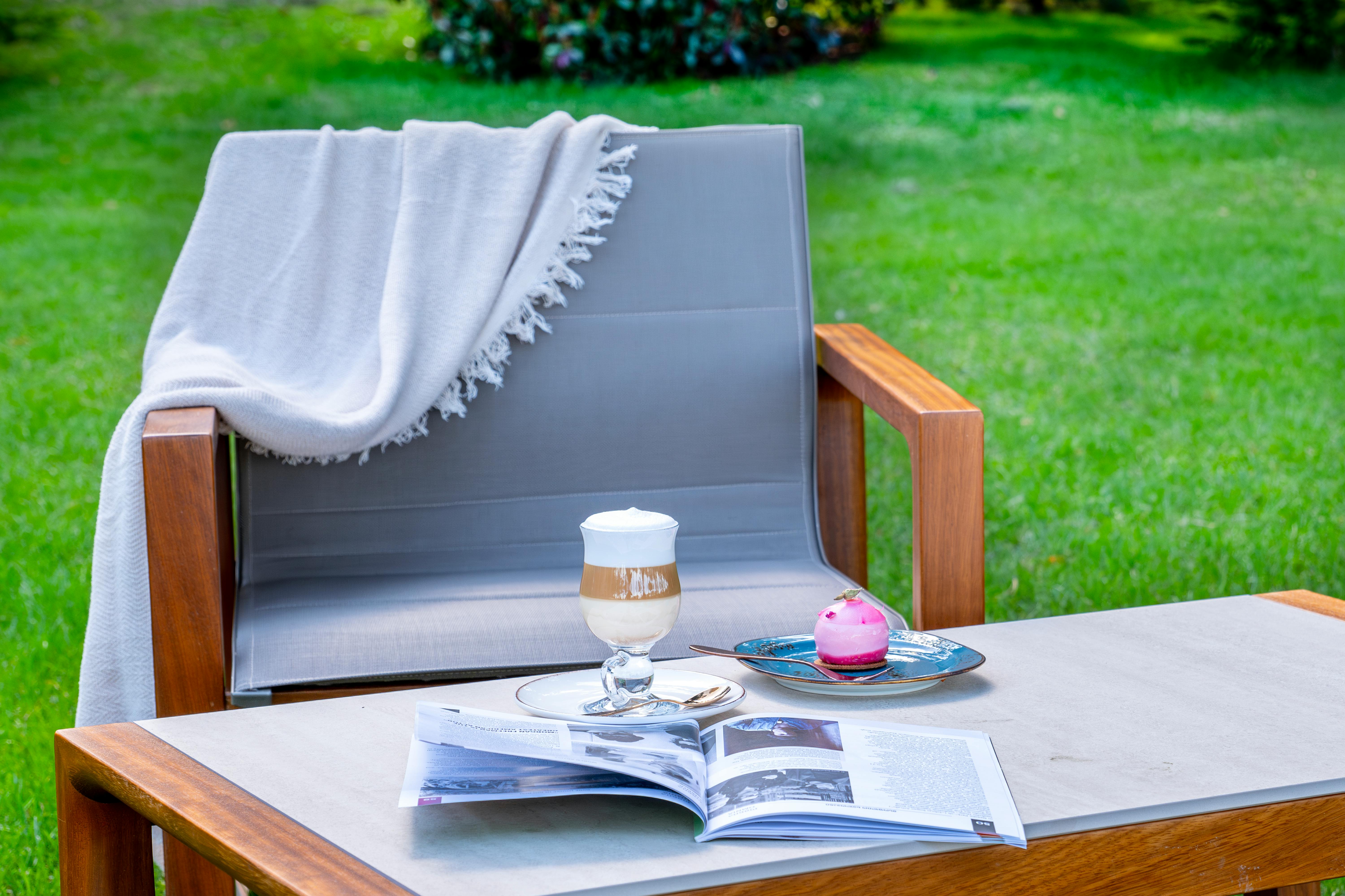 Cozy Outdoor Patio with Coffee and Pastry · Free Stock Photo