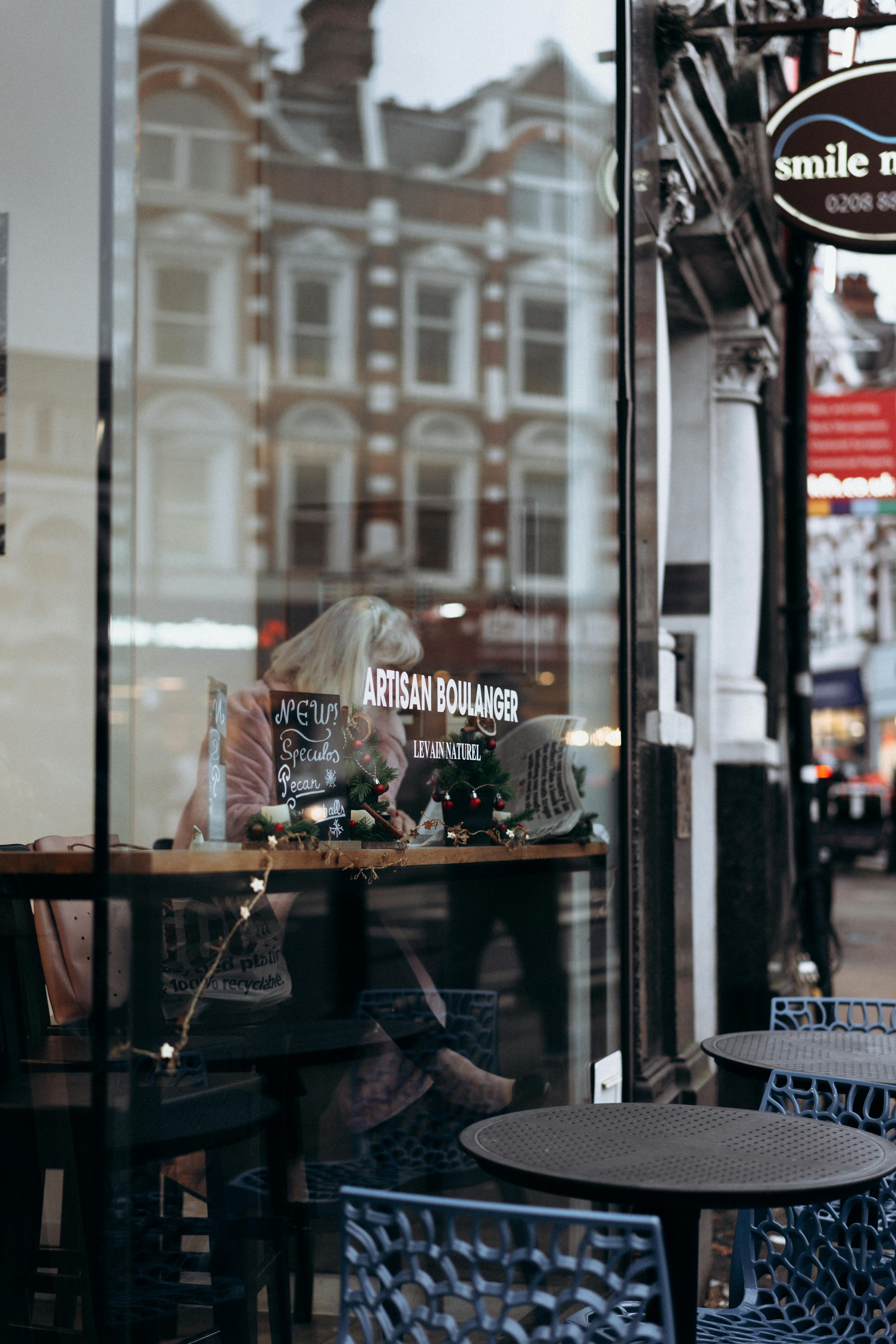 Charming London Cafe Scene Through Window Reflection · Free Stock Photo