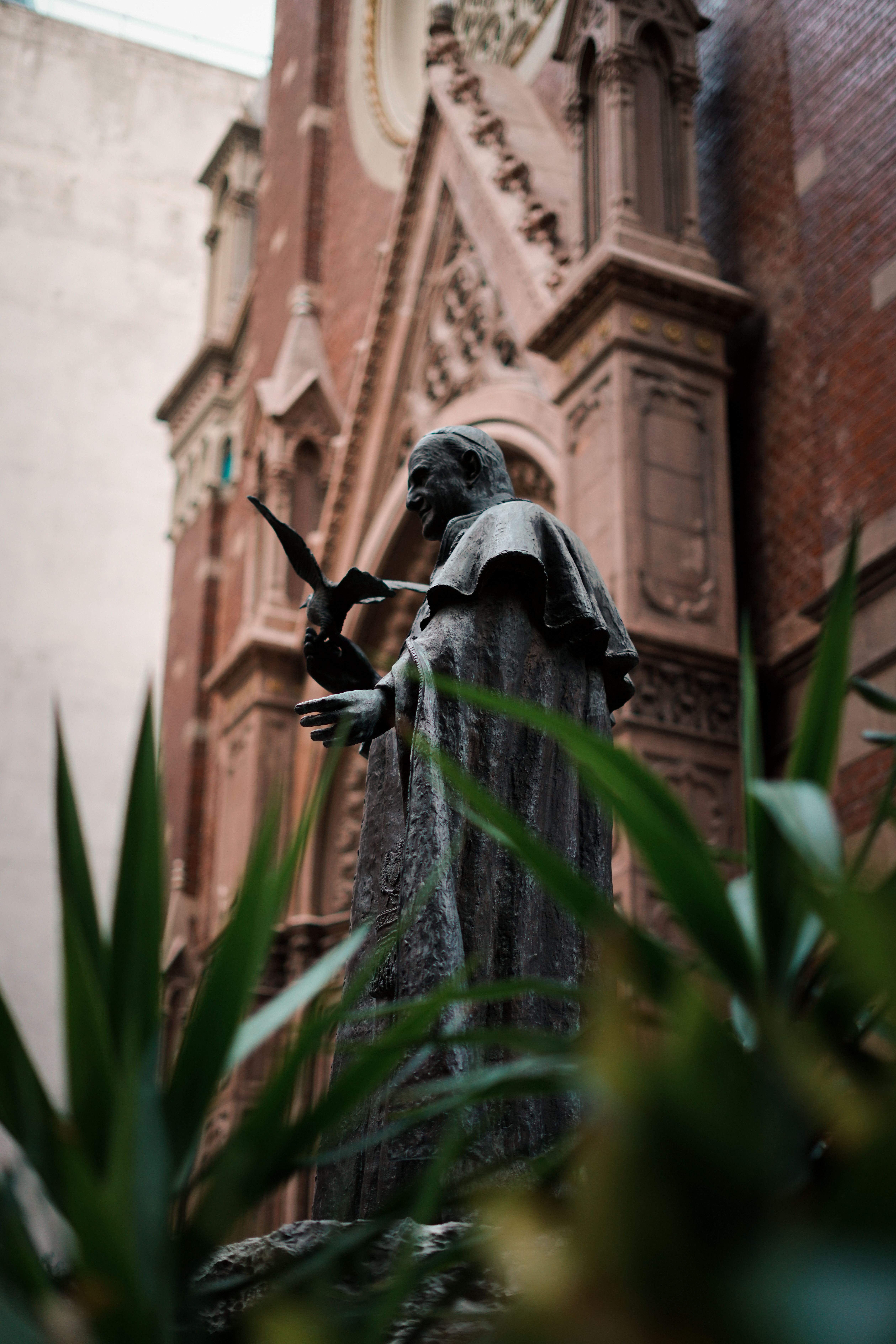 Historic Church Architecture with Saint Statue · Free Stock Photo