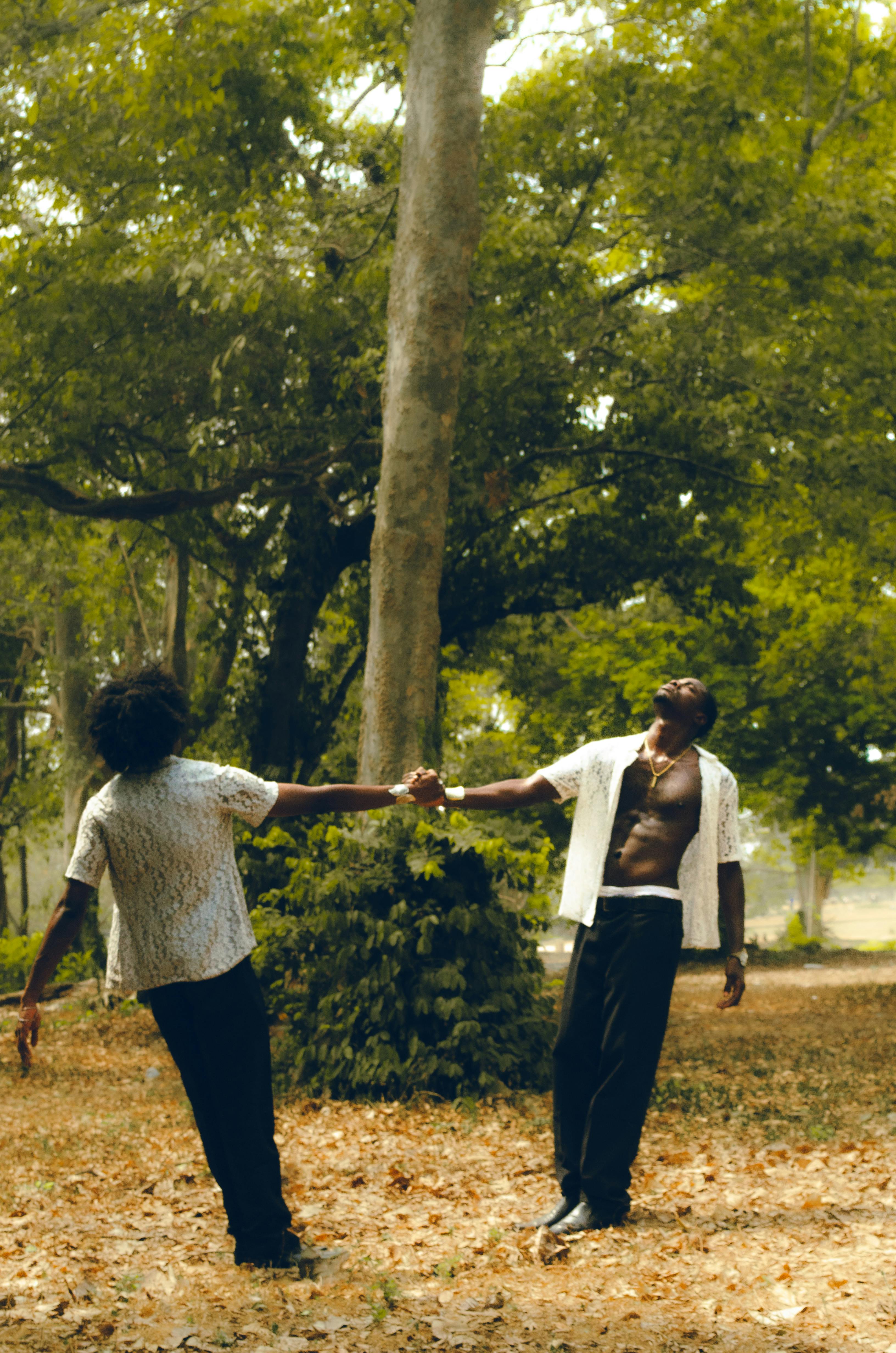 Two Friends Enjoying Nature in a Park · Free Stock Photo