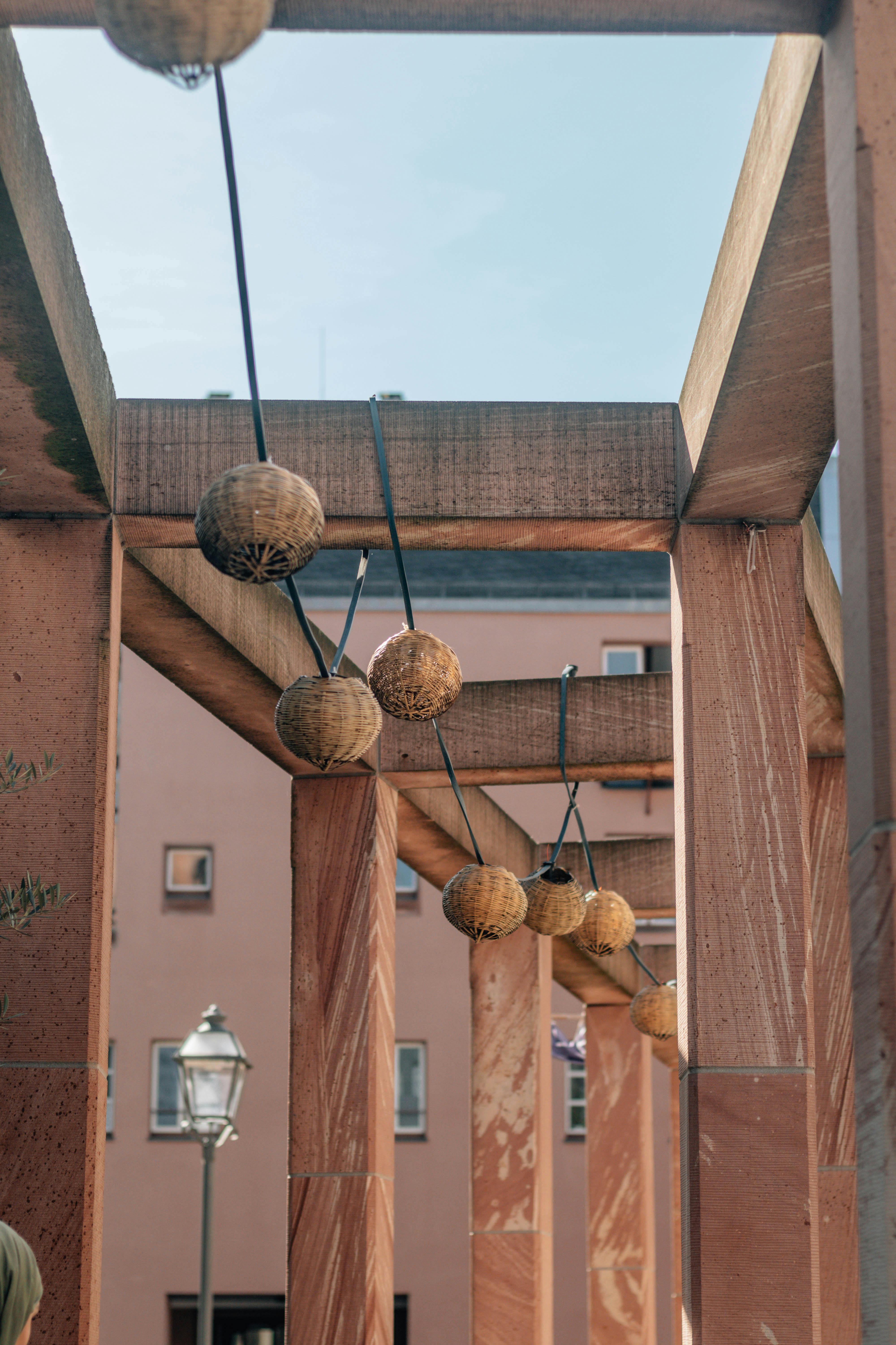 Outdoor Wooden Canopy with Wicker Spheres · Free Stock Photo