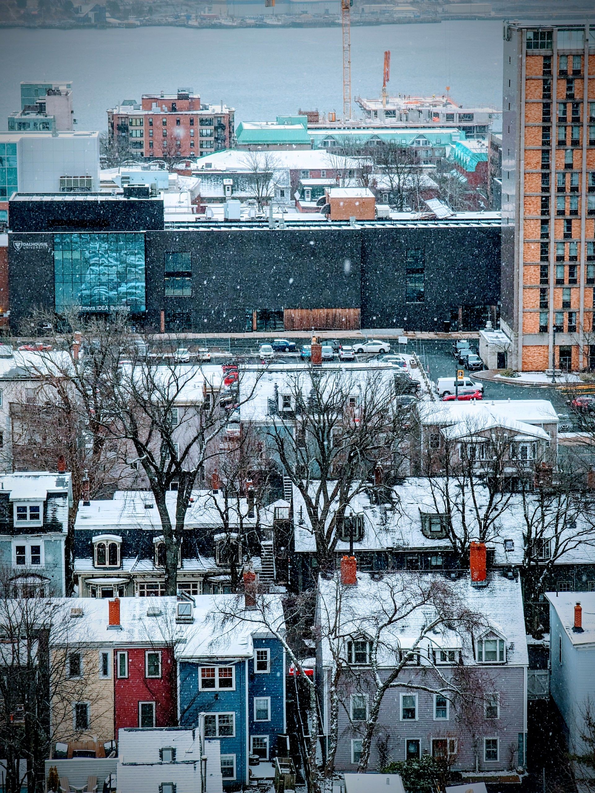 Snowfall Over Colorful Urban Neighborhood · Free Stock Photo