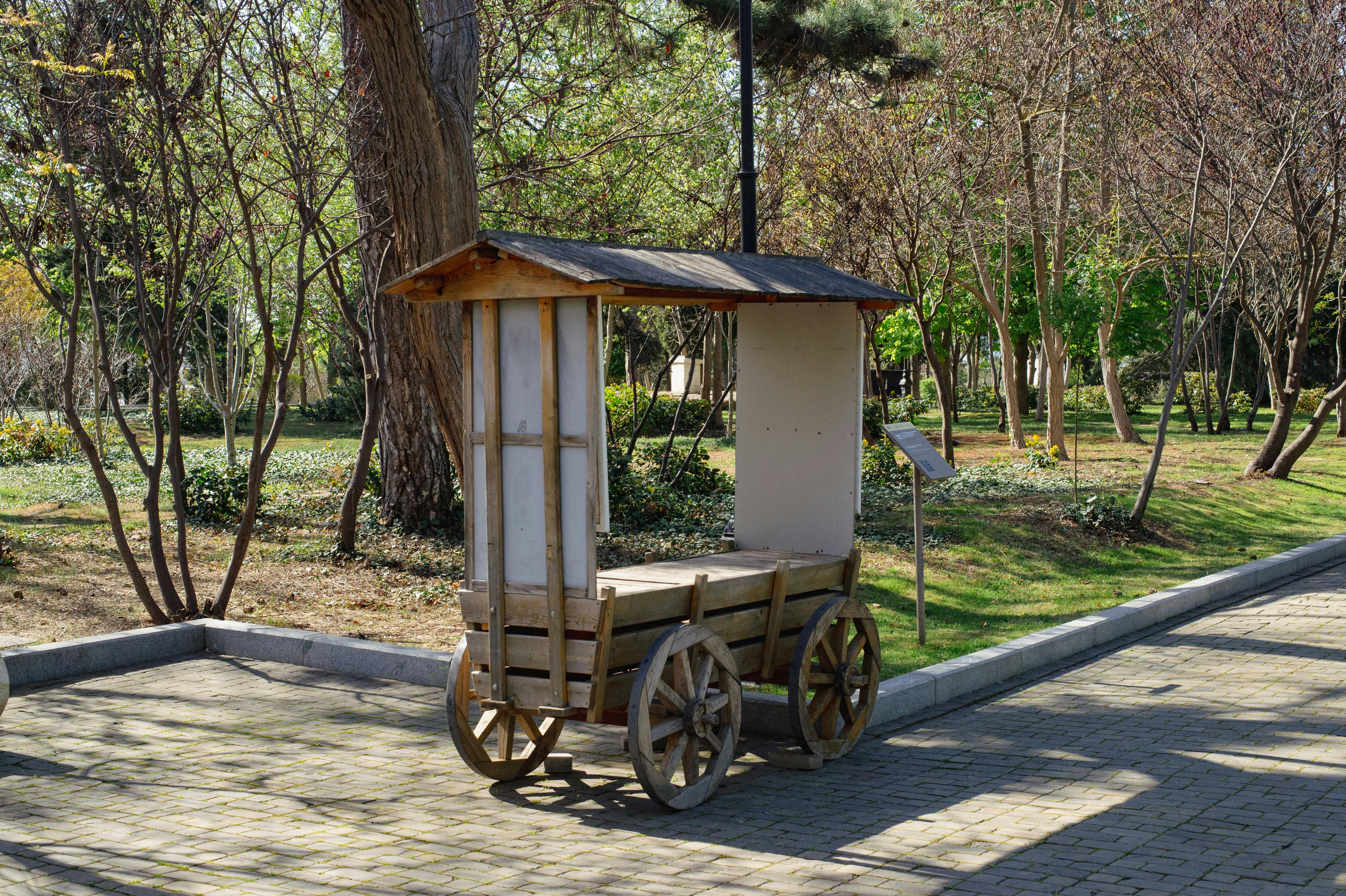 Rustic Wooden Cart in Peaceful Park Setting · Free Stock Photo