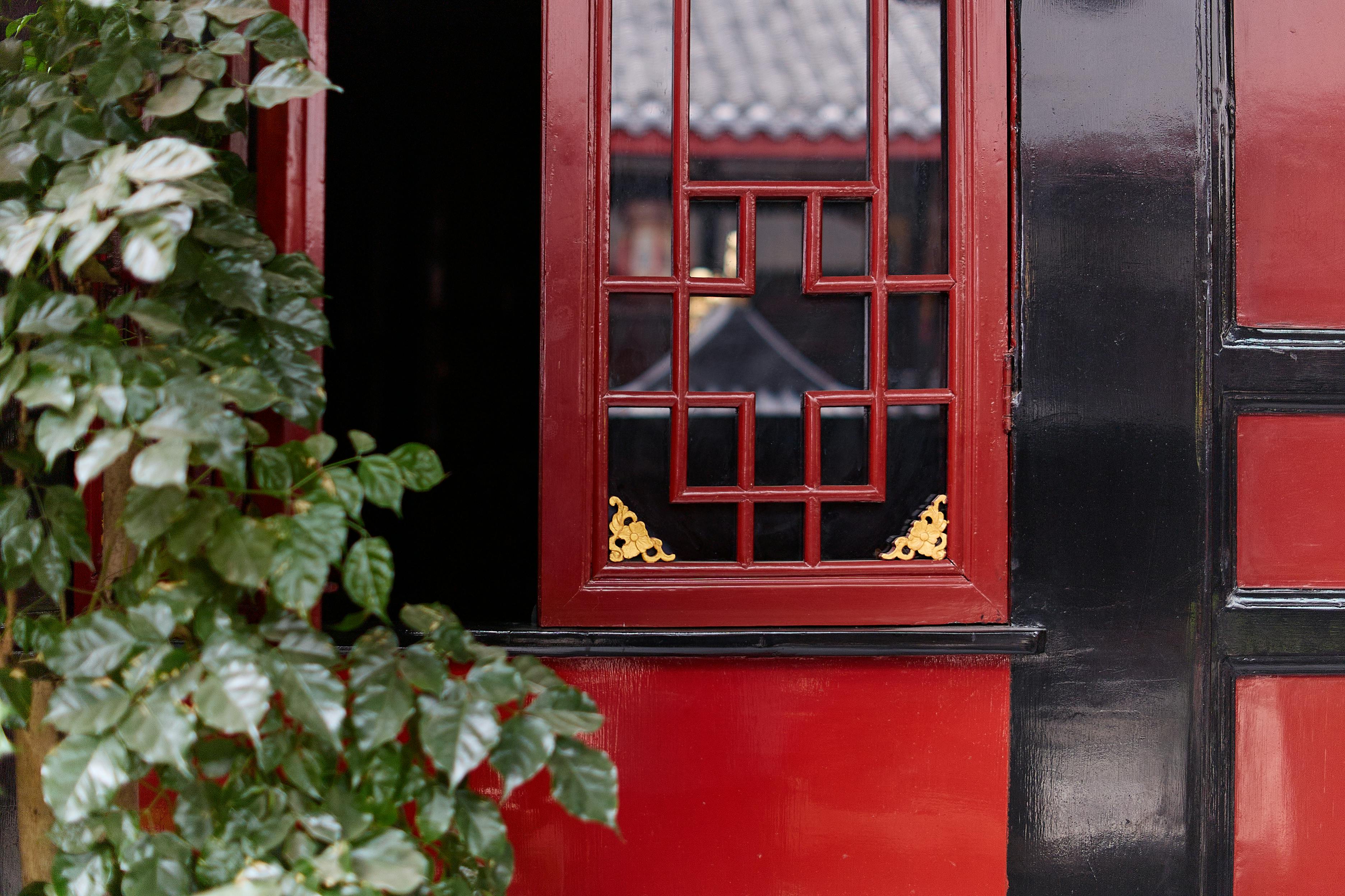 Traditional Red and Black Asian Window with Foliage · Free Stock Photo