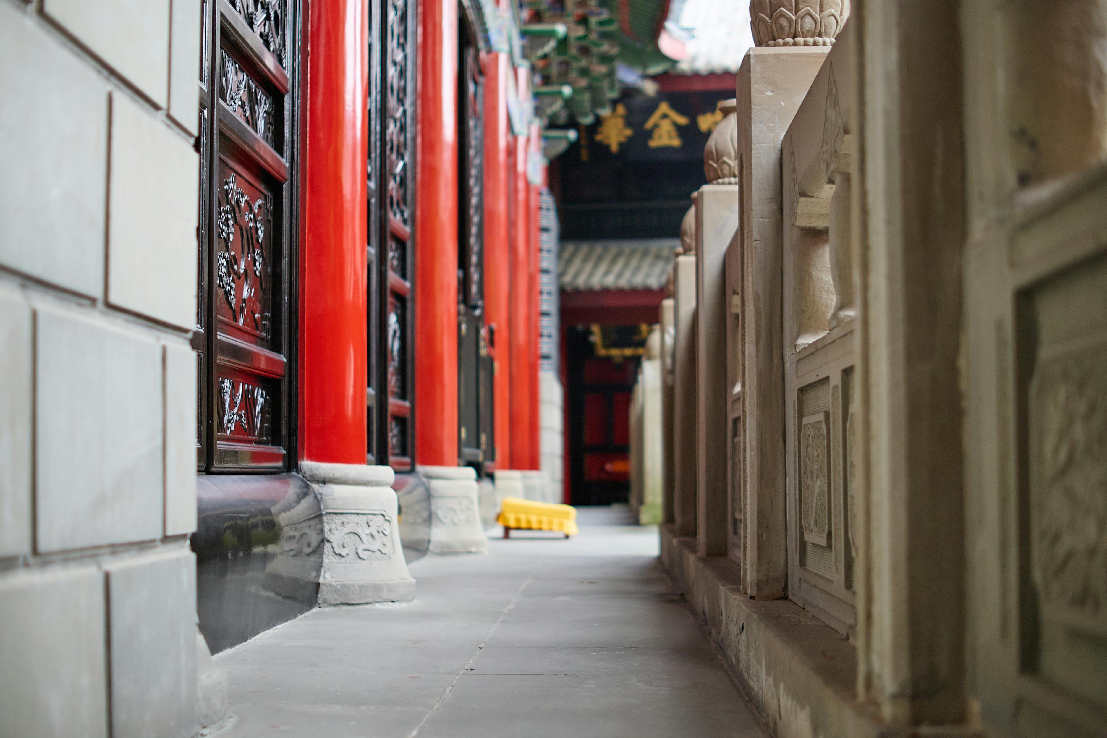 Intricate Asian Temple Architecture with Red Pillars · Free Stock Photo