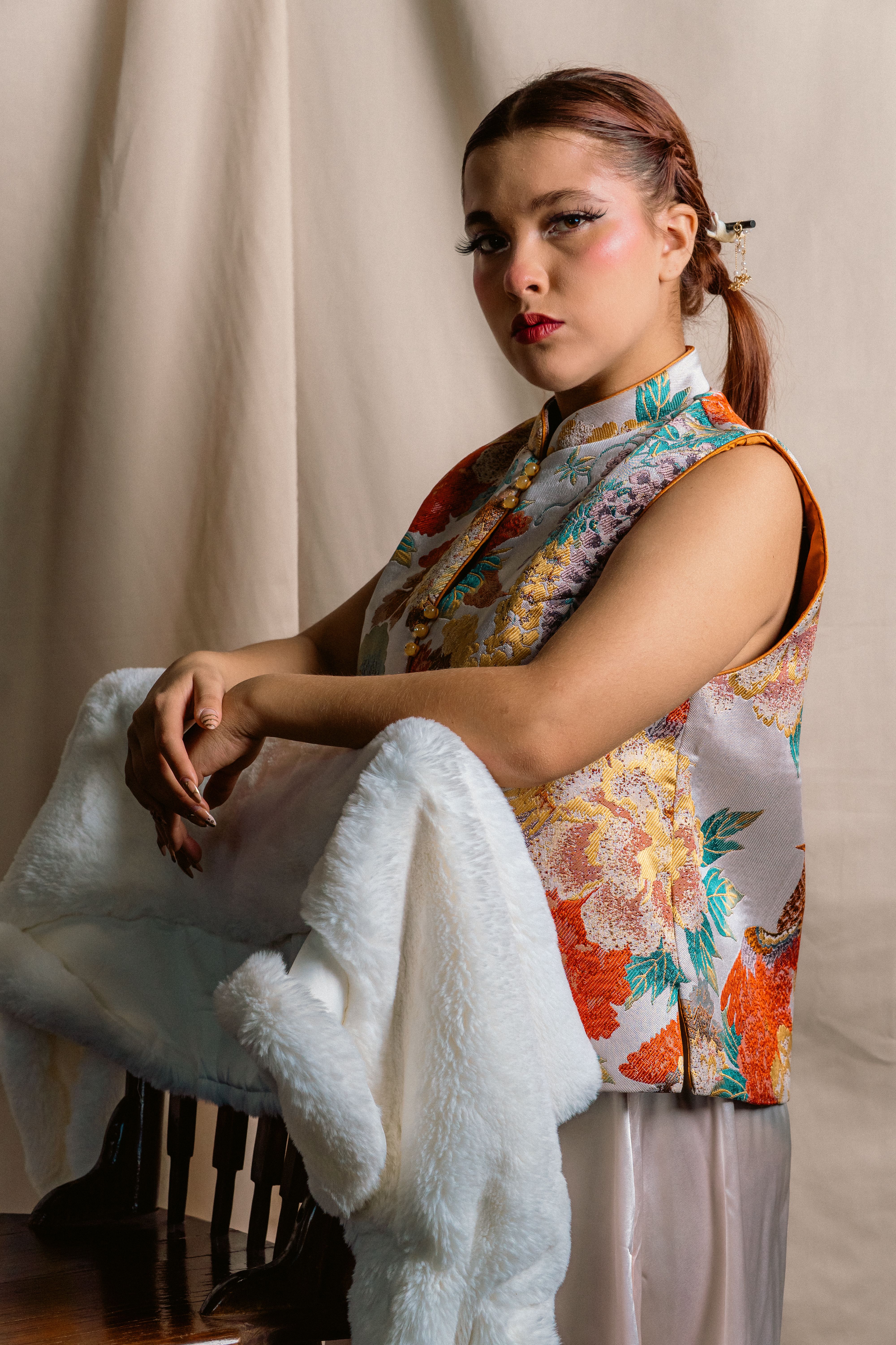Elegant Woman in Colorful Asian-Inspired Attire · Free Stock Photo