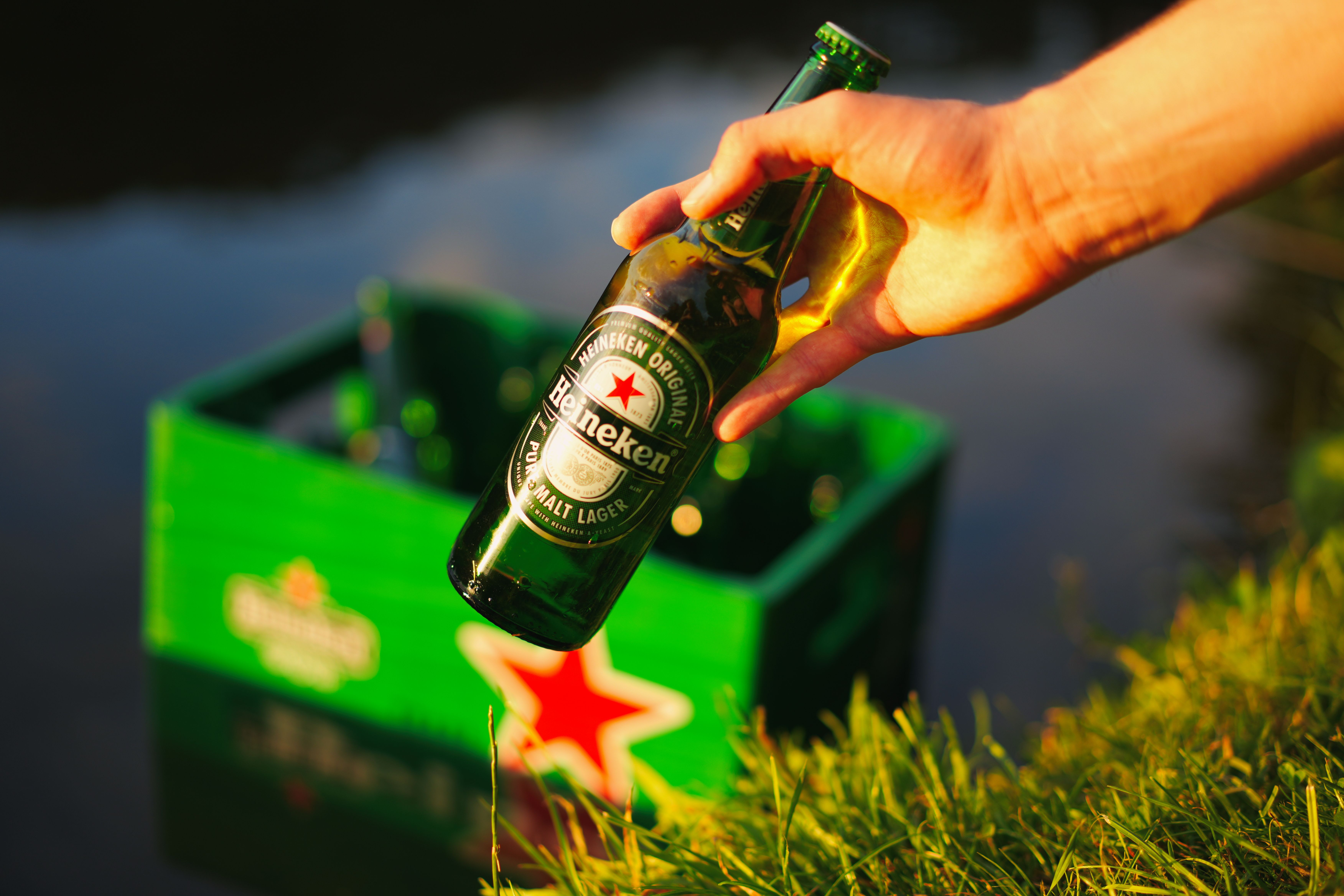 Refreshing Heineken Beer in Outdoor Leisure Setting · Free Stock Photo