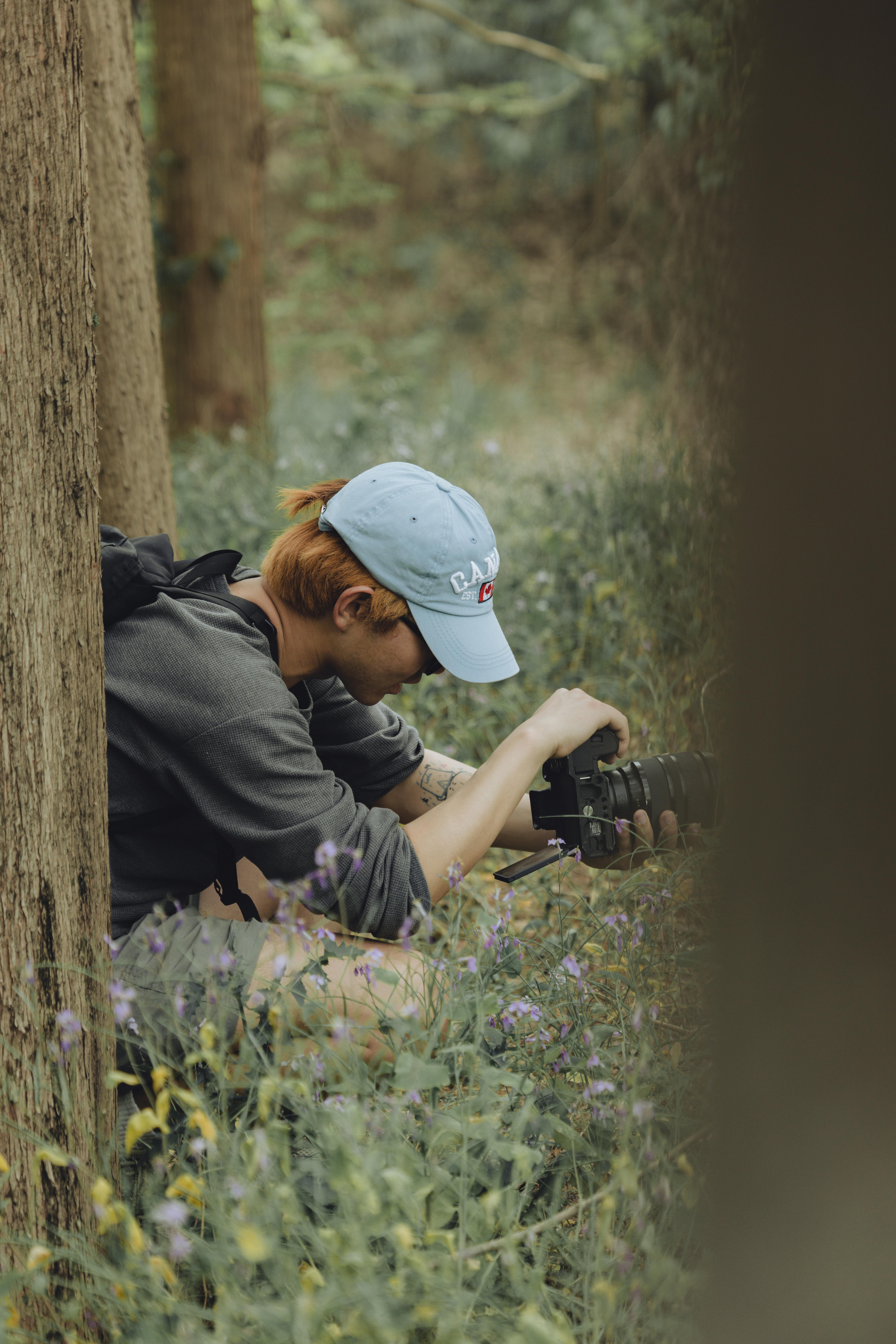 Nature Photographer Capturing Scenic Forest Shots · Free Stock Photo