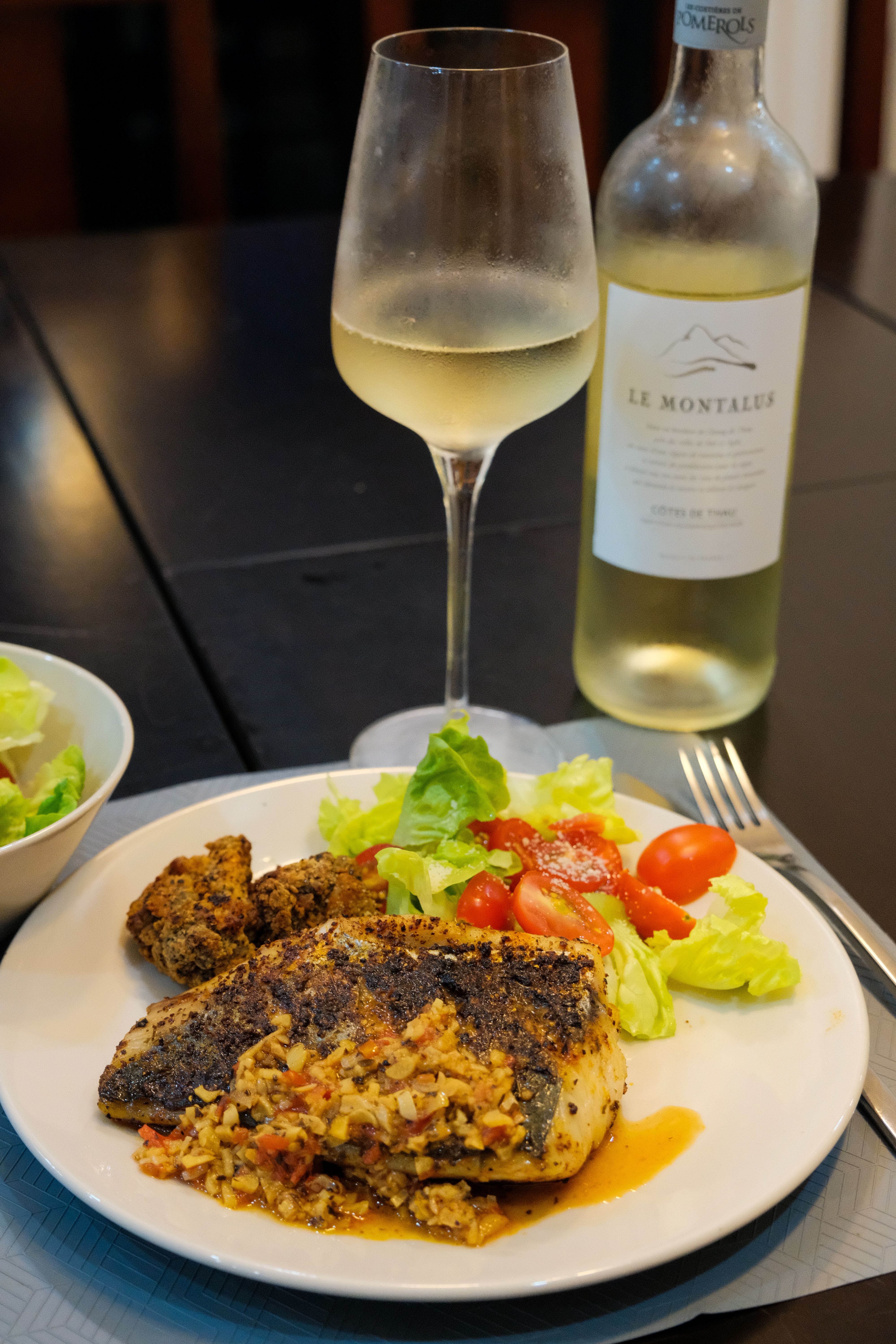 Elegant Dinner Setting with Wine and Chicken · Free Stock Photo