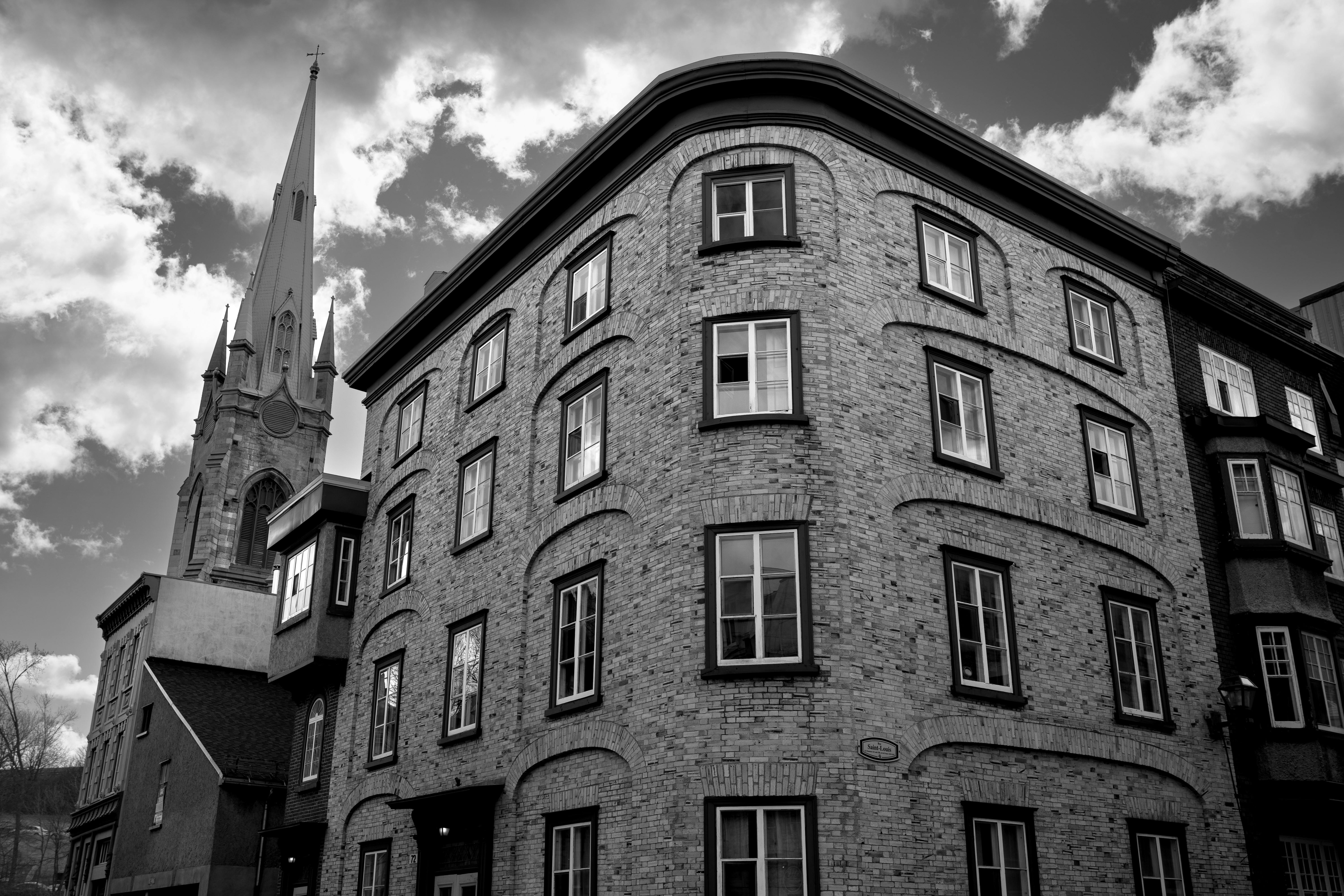 Historic Brick Building with Church Spire · Free Stock Photo