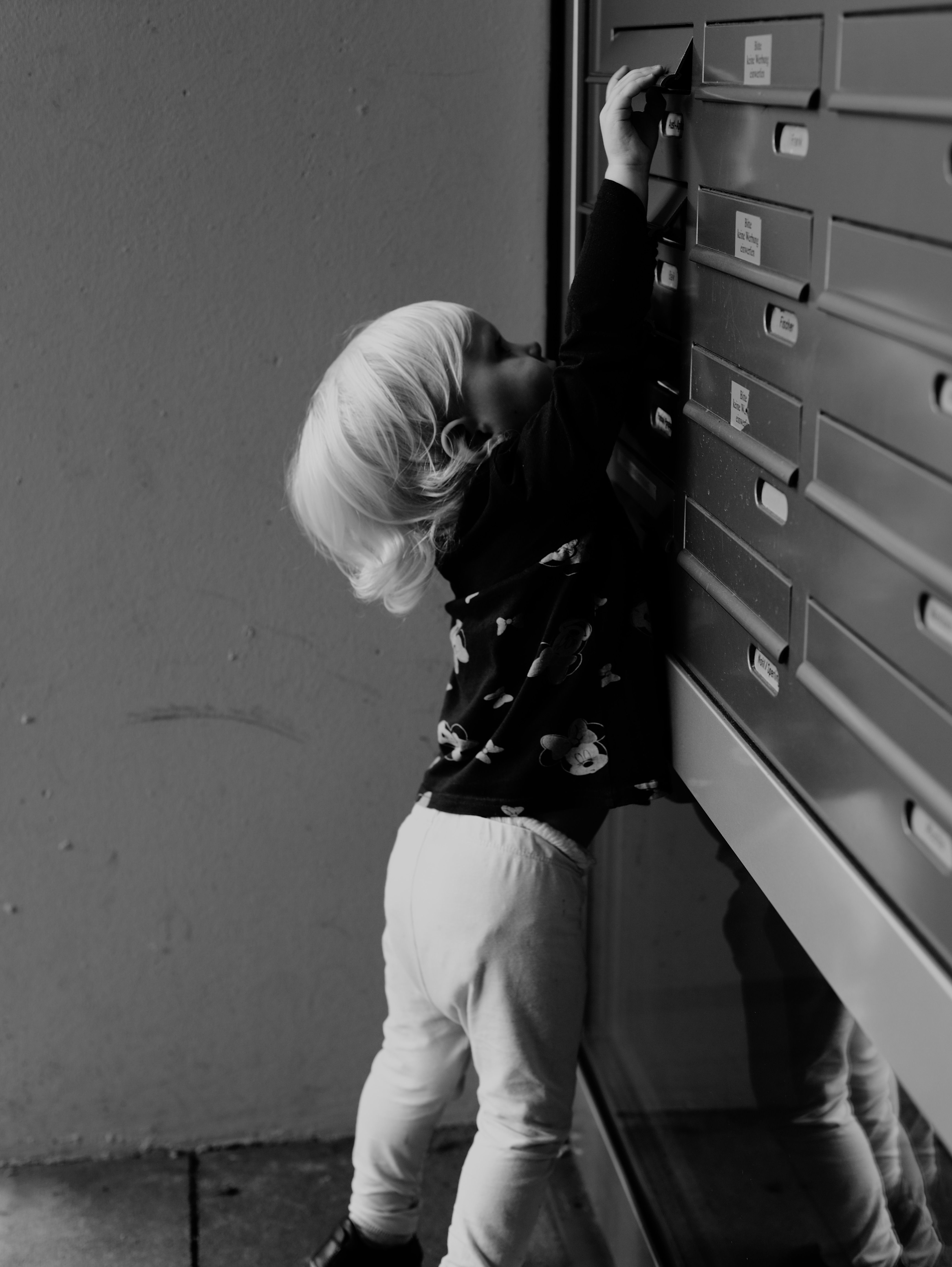 Cute Toddler Reaching for Mailbox in Black and White · Free Stock Photo