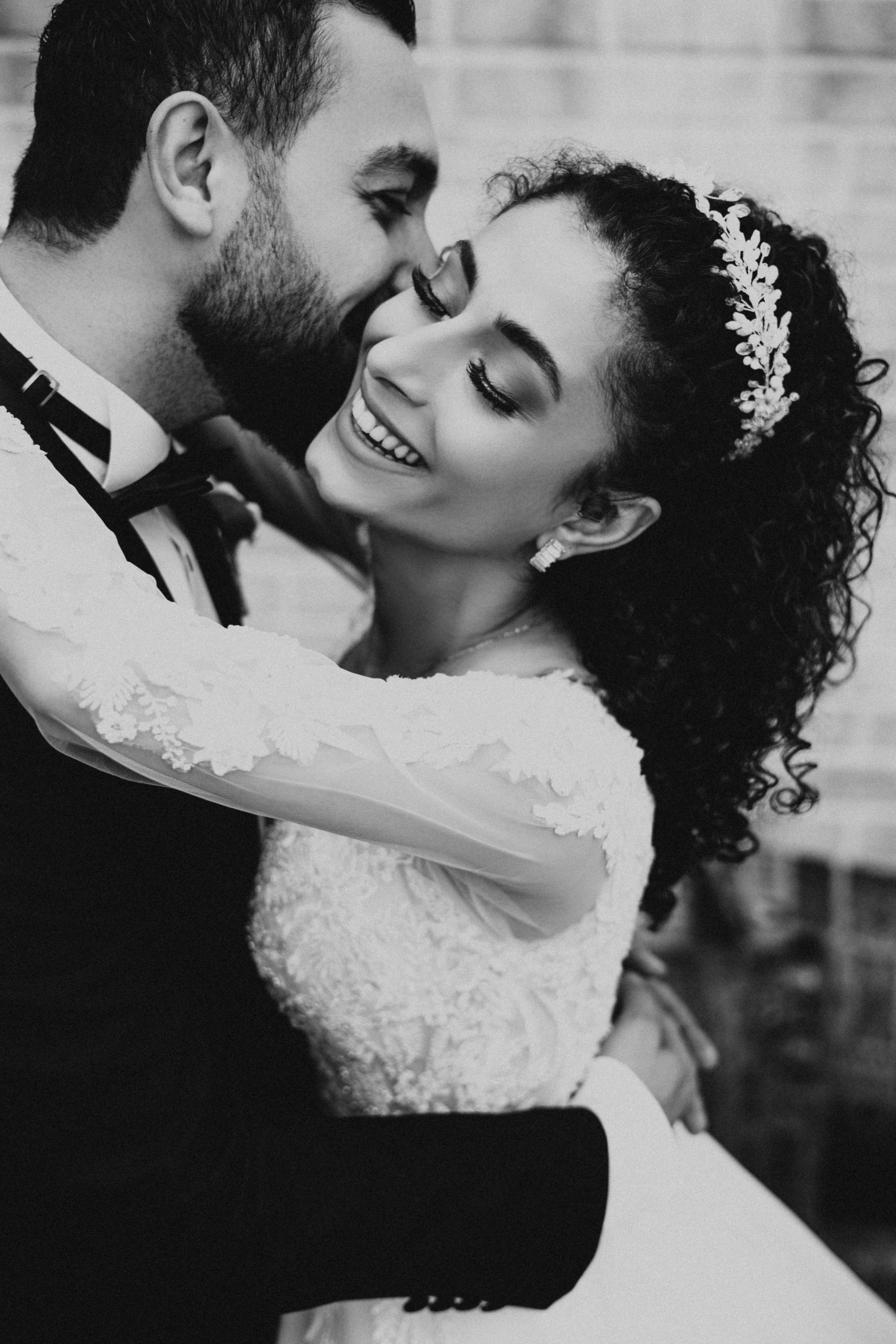 Joyful Bride and Groom Embrace on Wedding Day · Free Stock Photo