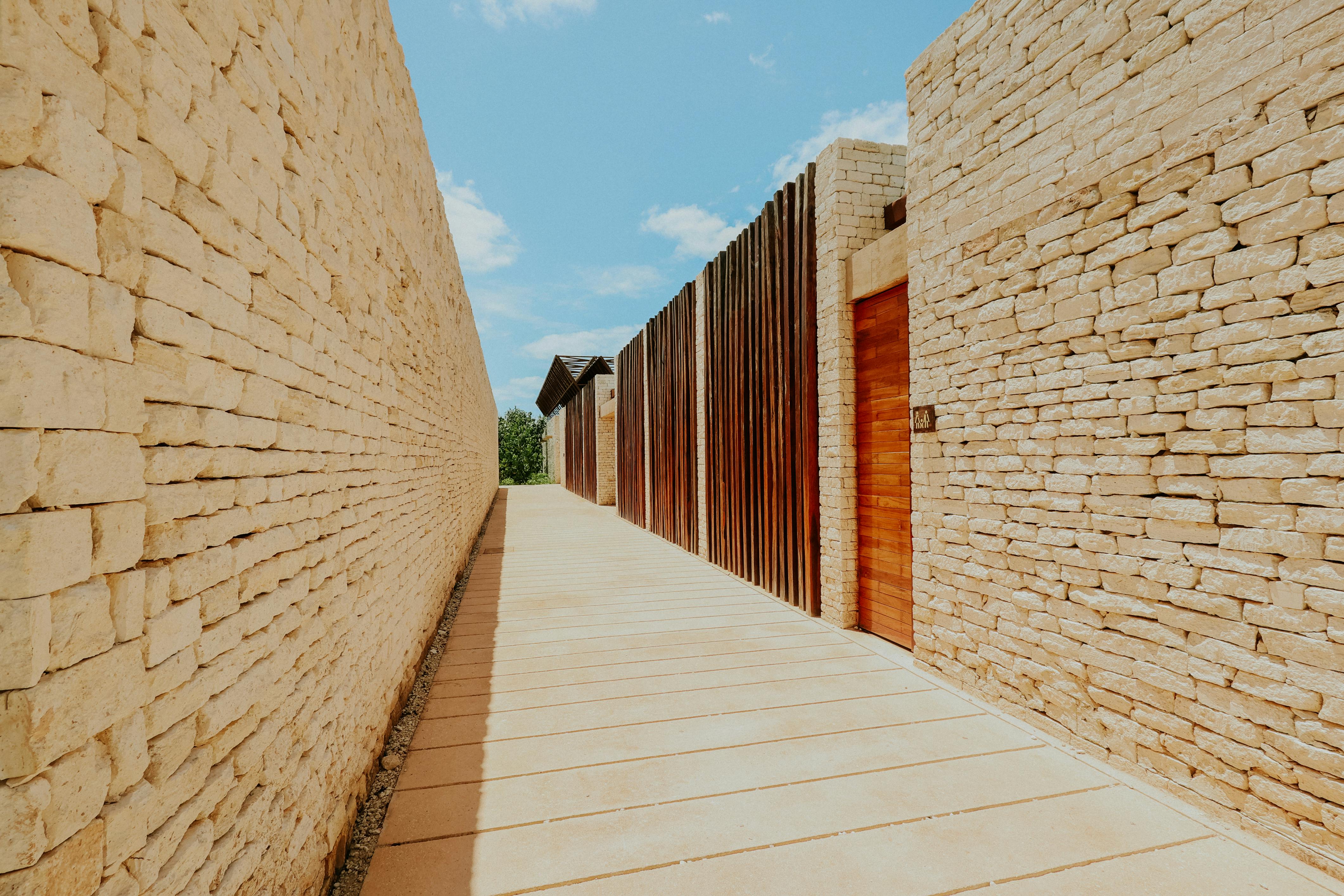 Stone and Wood Architecture in Bright Daylight · Free Stock Photo