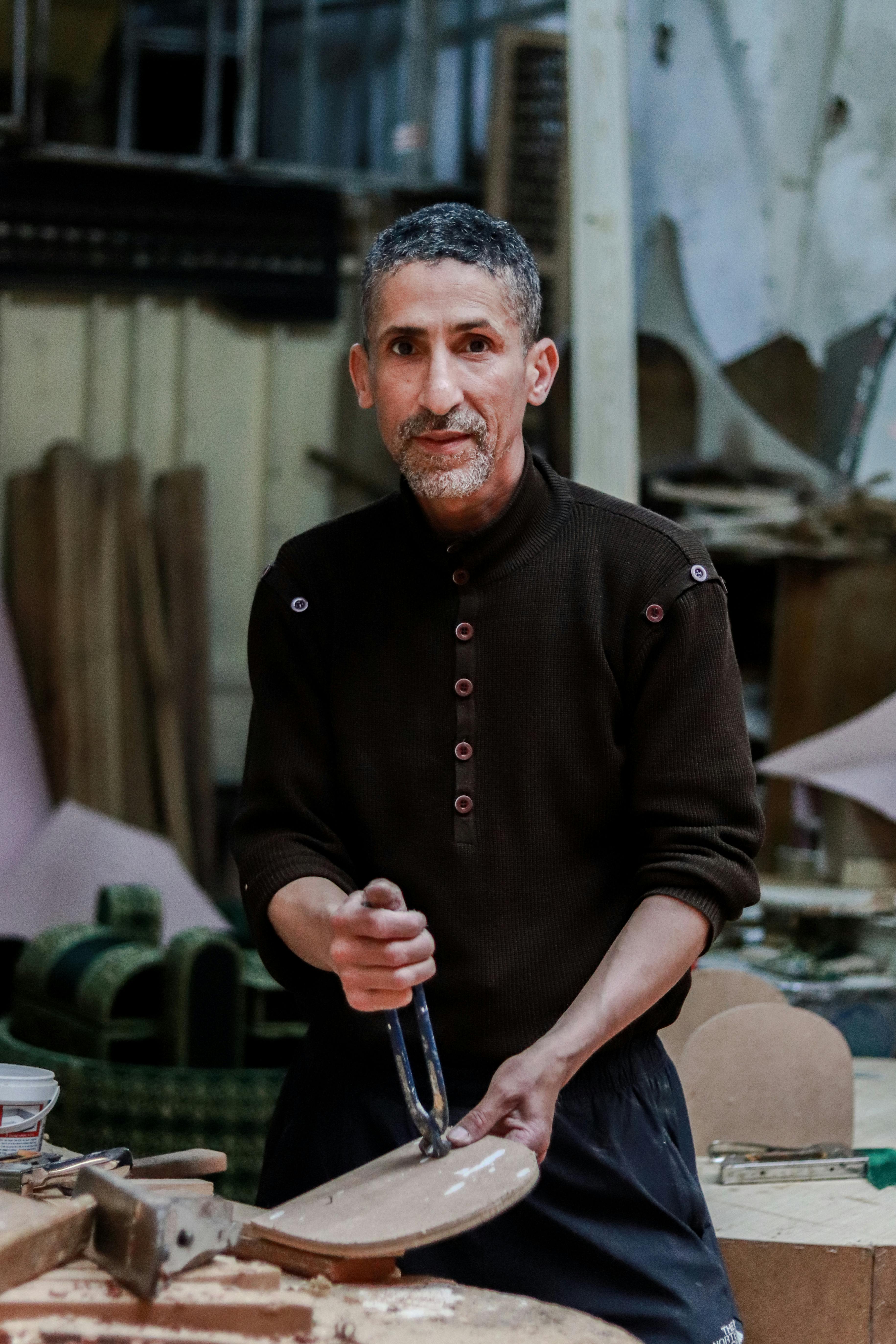 Skilled Woodworker Crafting in Workshop · Free Stock Photo