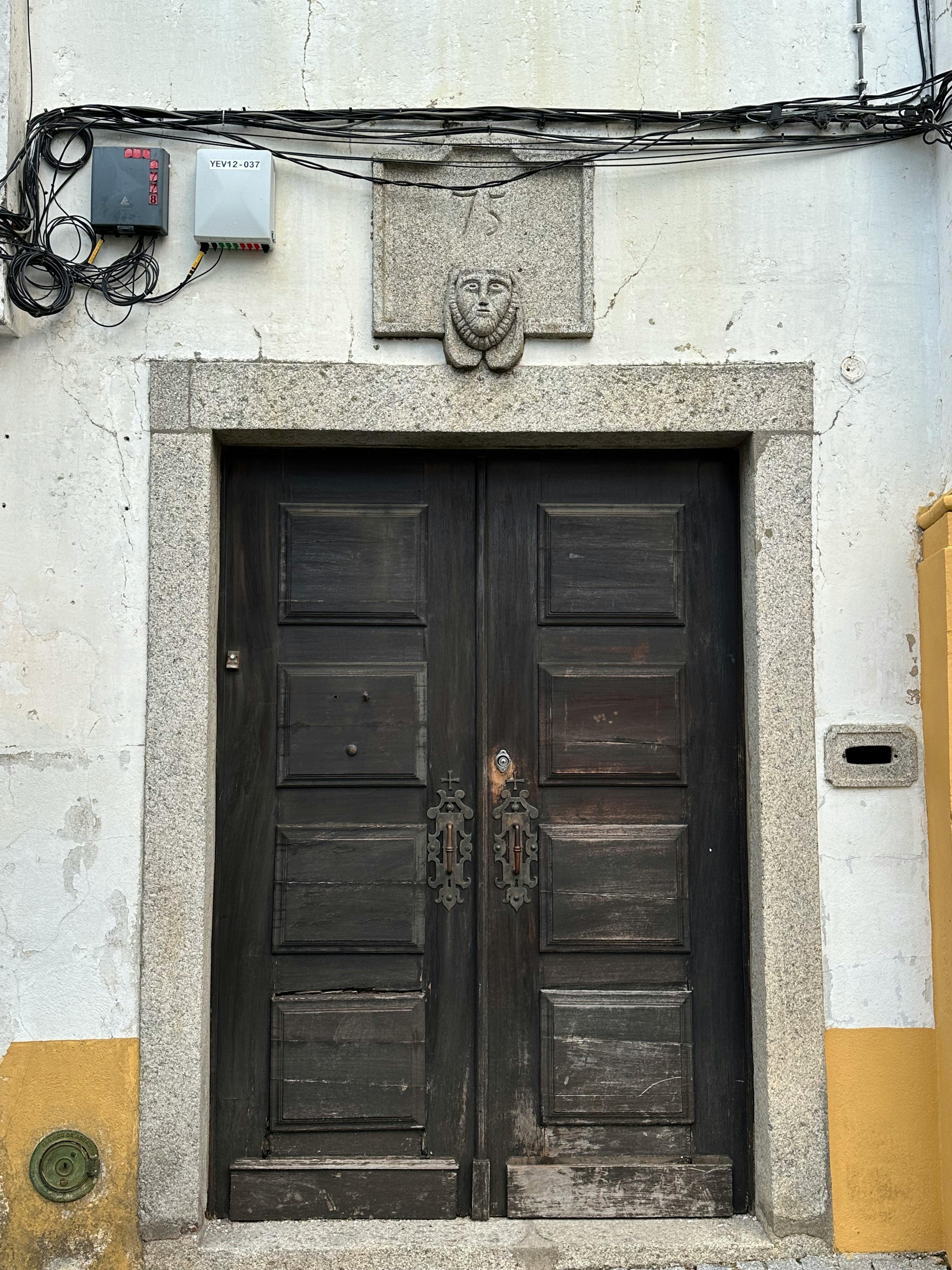 Rustic Wooden Doorway with Stone Frame in Évora · Free Stock Photo