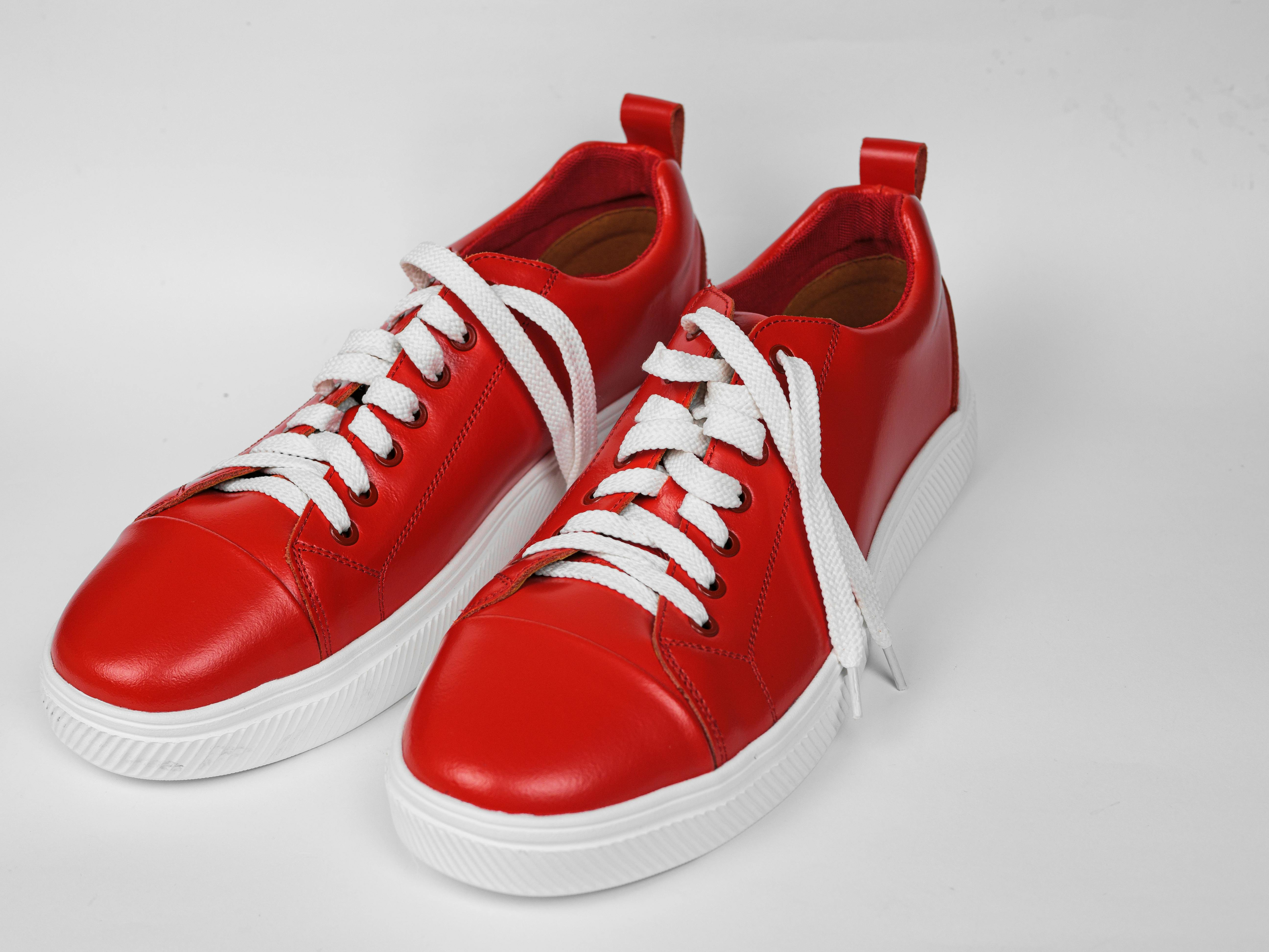 Bright Red Sneakers on White Background · Free Stock Photo