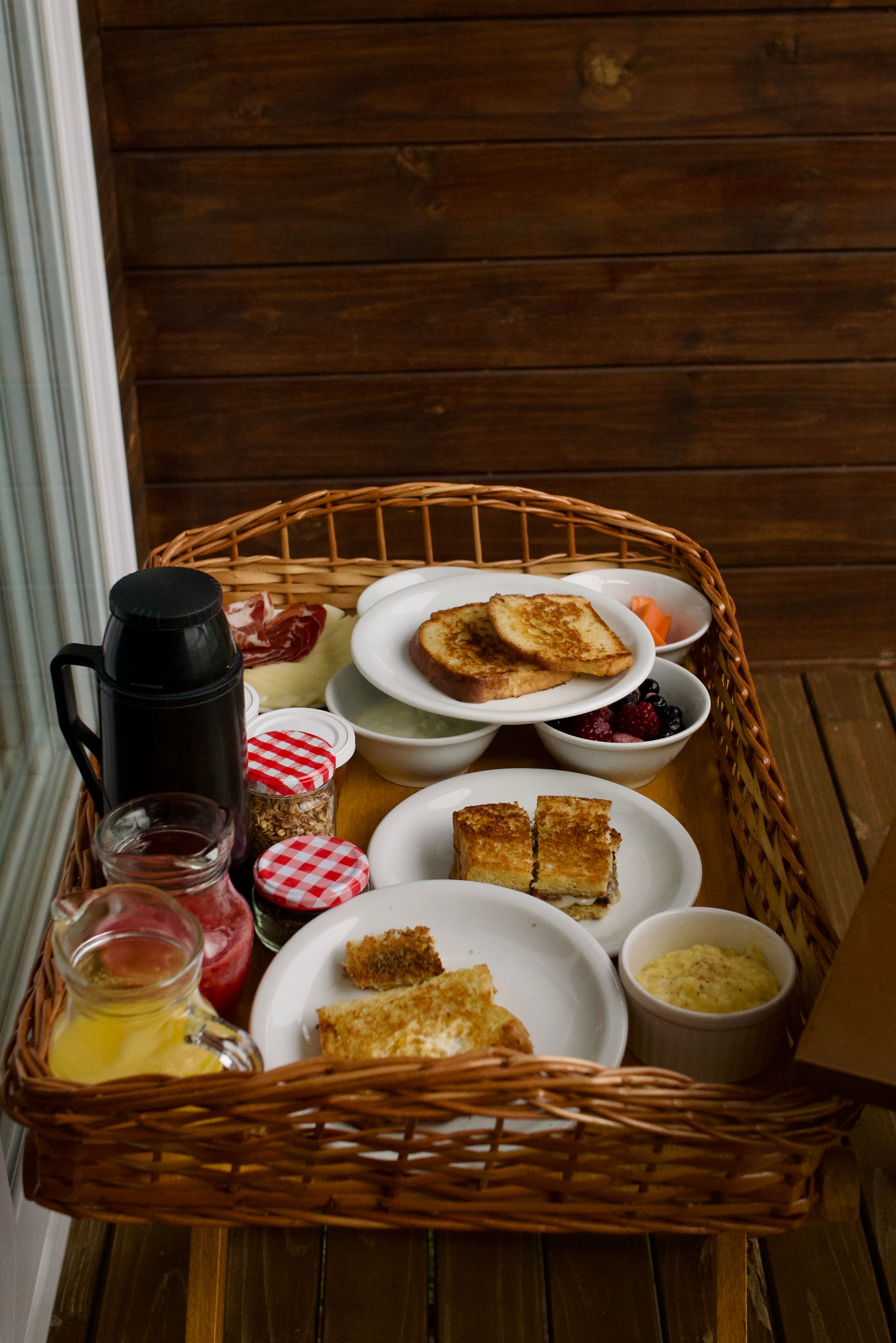 Delightful Outdoor Breakfast on Wooden Deck · Free Stock Photo