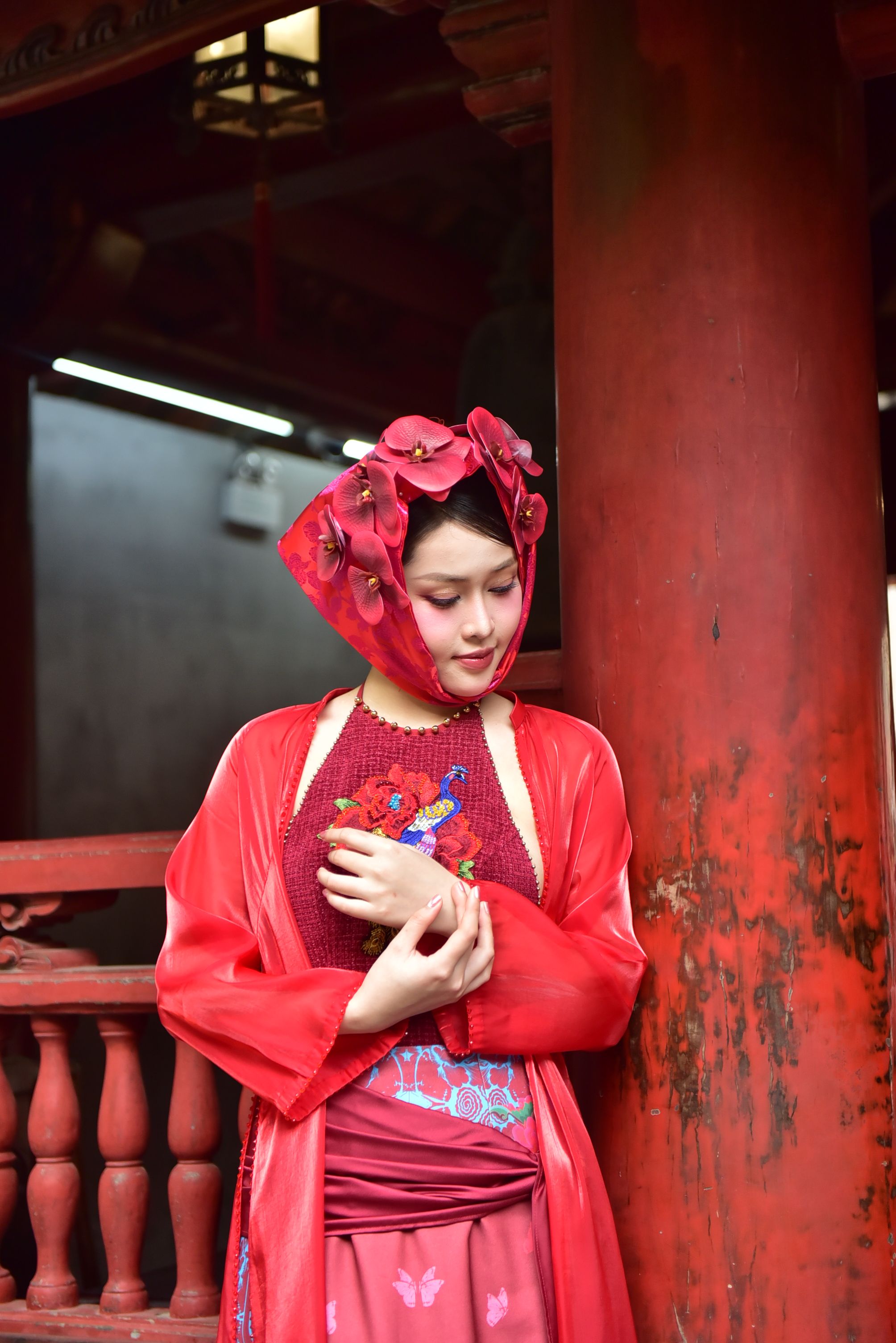 Elegant Woman in Traditional Red Garb Outdoors · Free Stock Photo